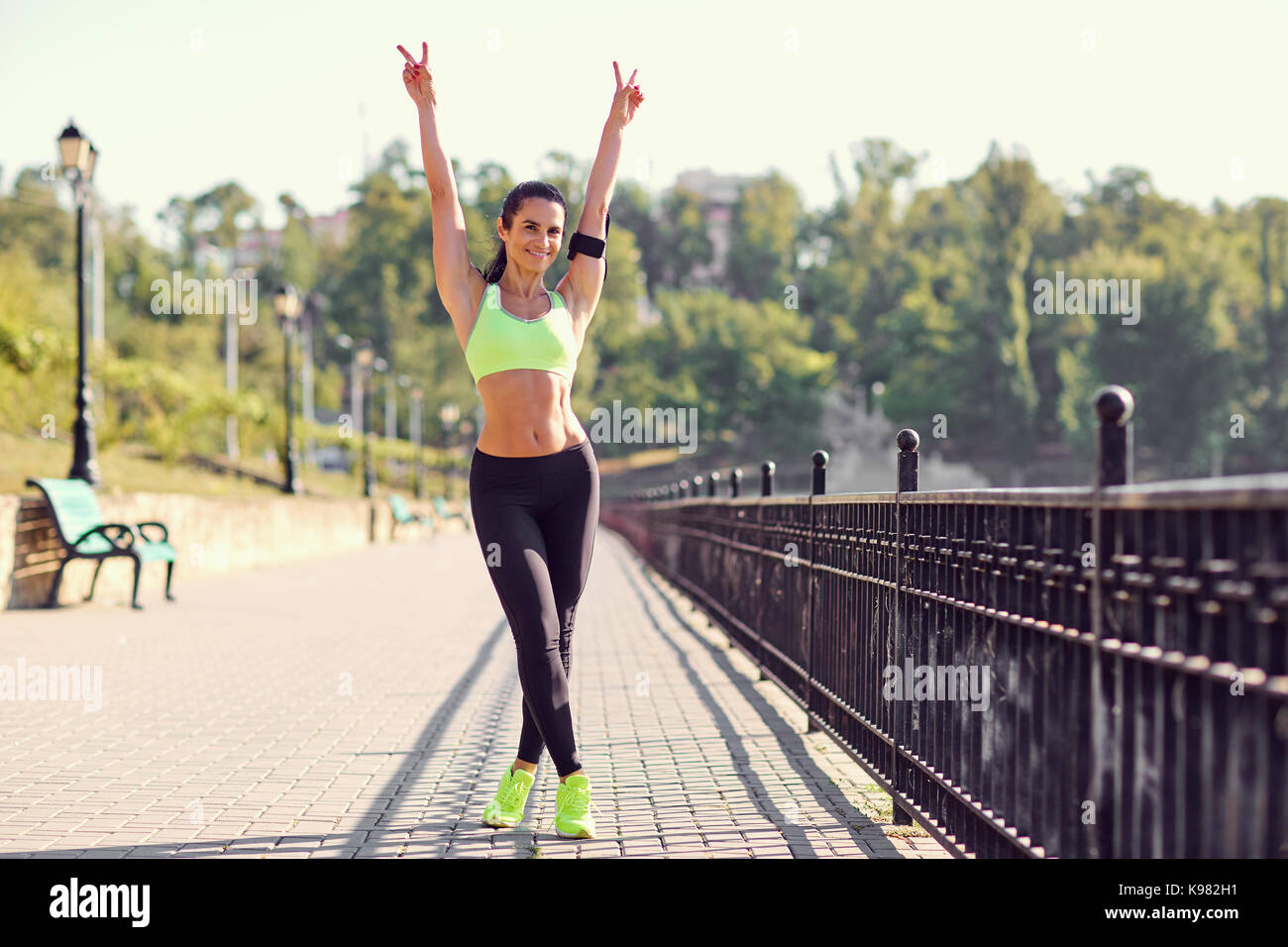 Smiling hand raised sport hi-res stock photography and images - Alamy