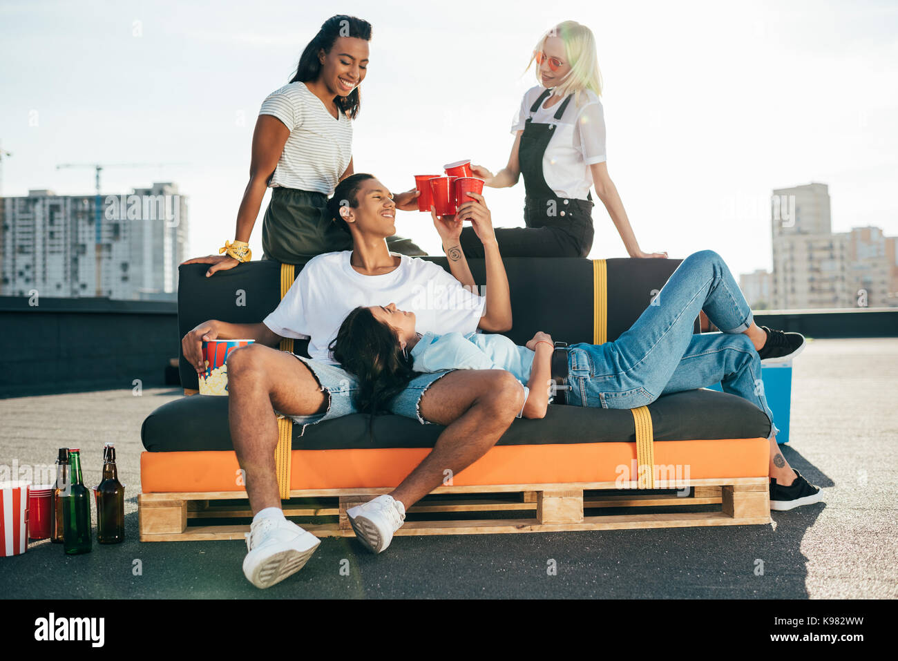 friends relaxing on roof Stock Photo - Alamy