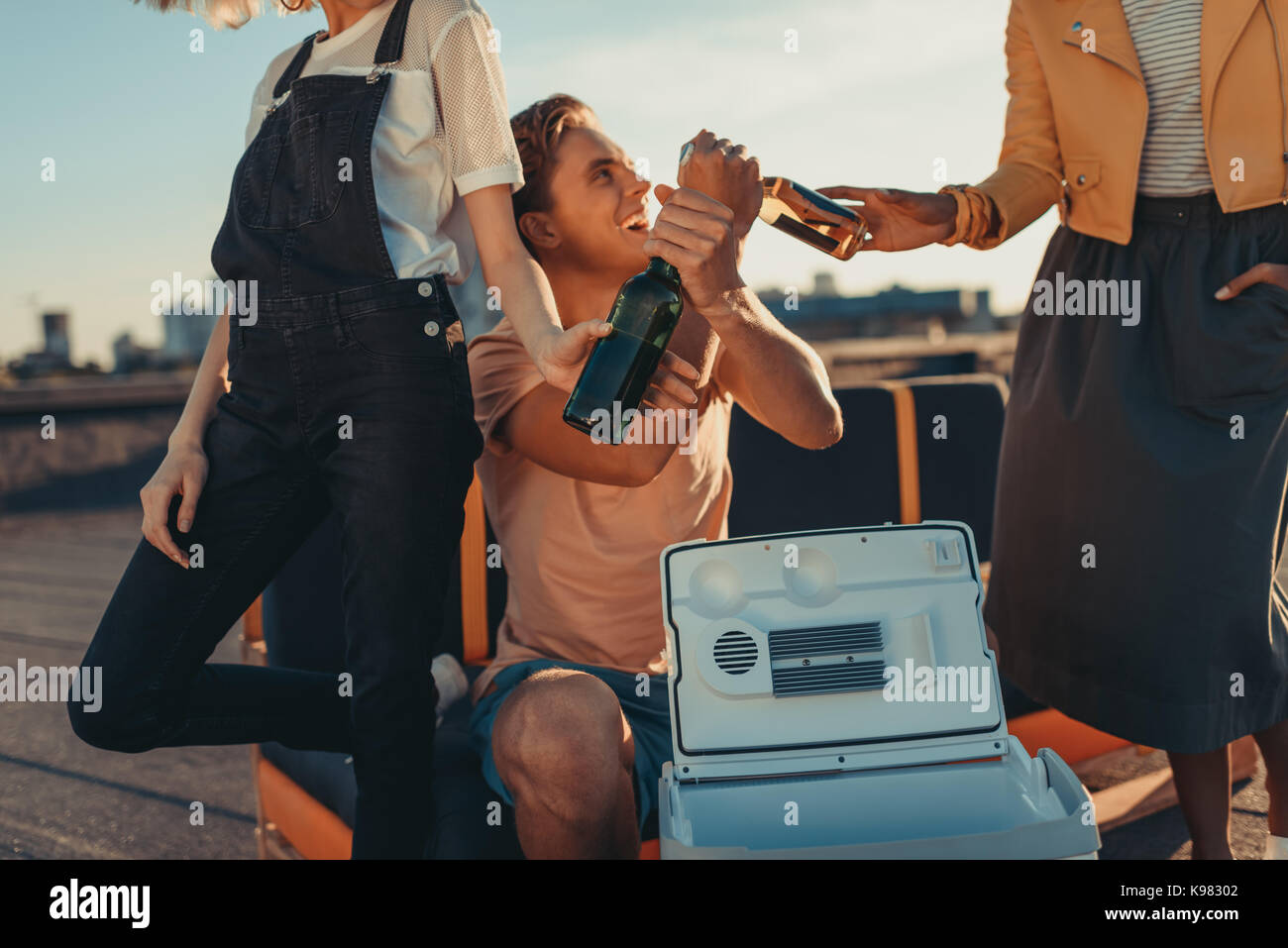 man giving beer to women Stock Photo - Alamy