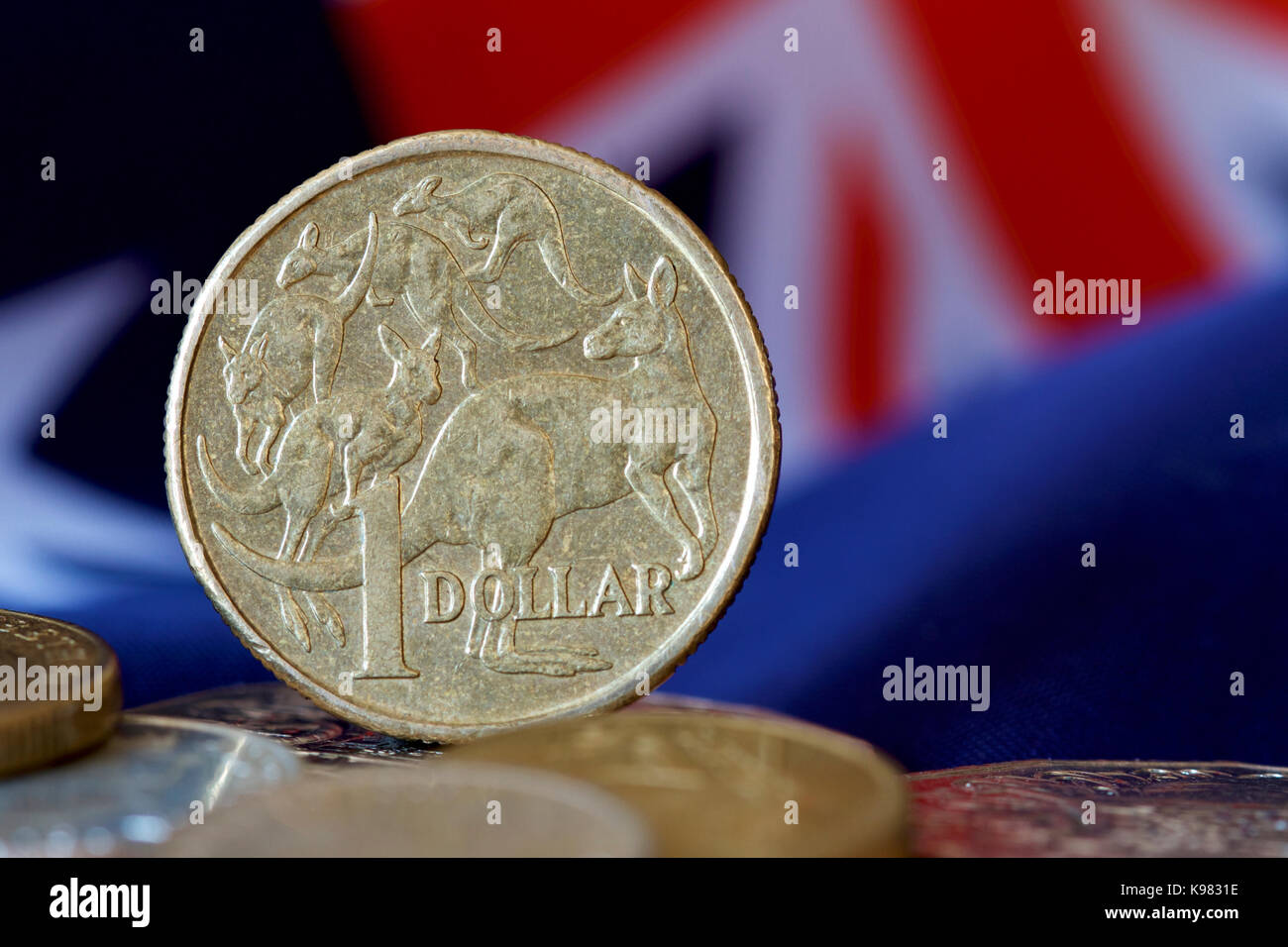 Australian one dollar coin with a background of the national flag Stock ...
