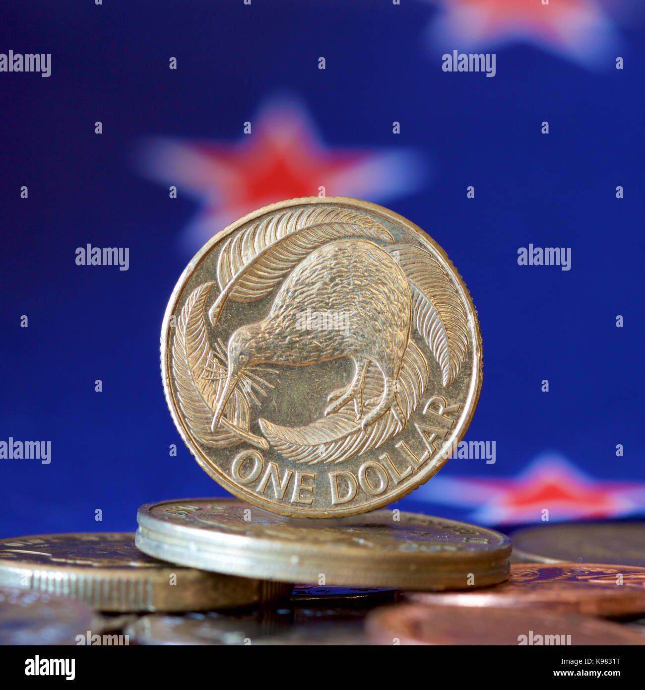 NZ one dollar coin with background of national flag Stock Photo - Alamy