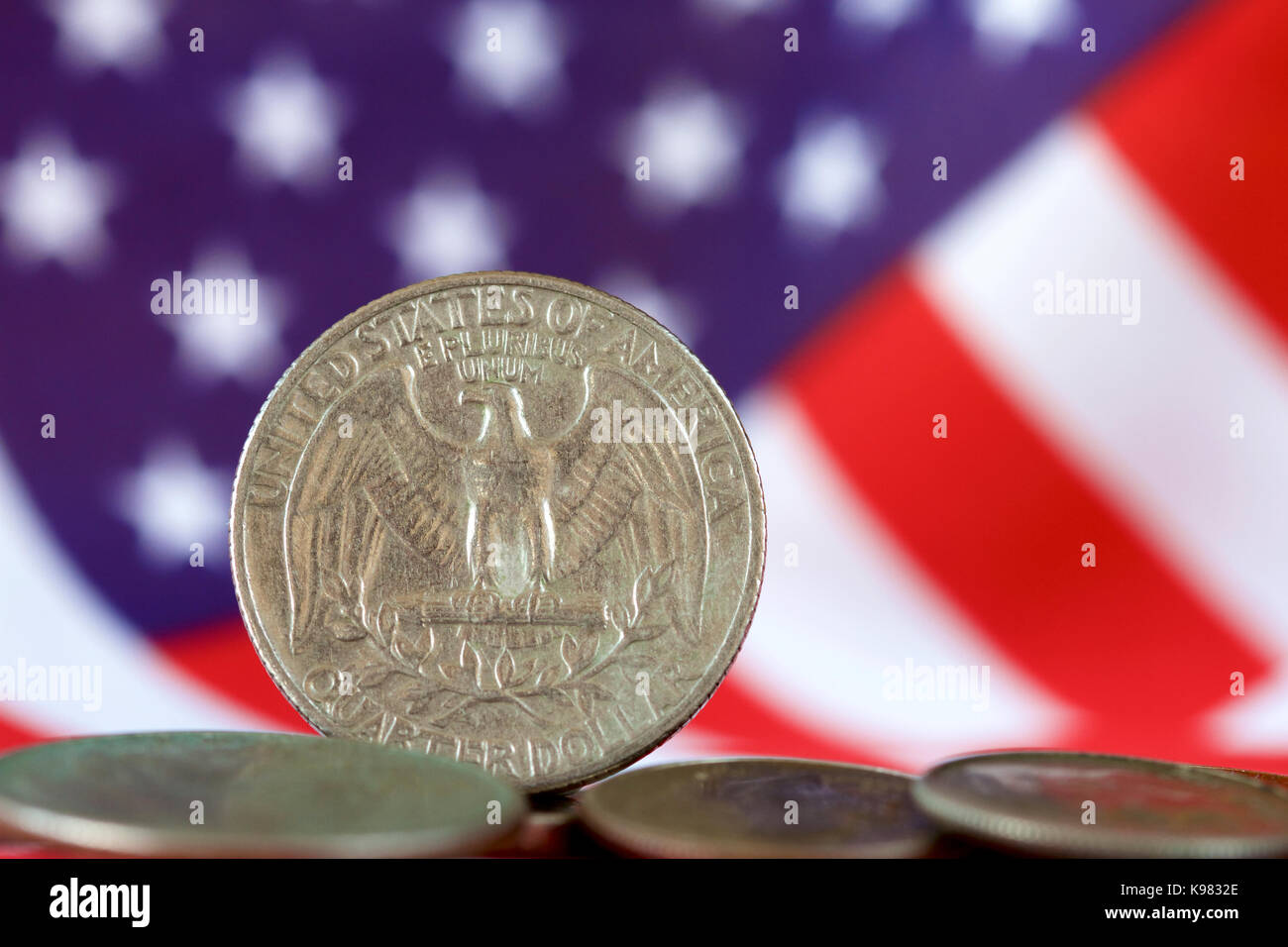 America quarter coin on background of national flag Stock Photo - Alamy