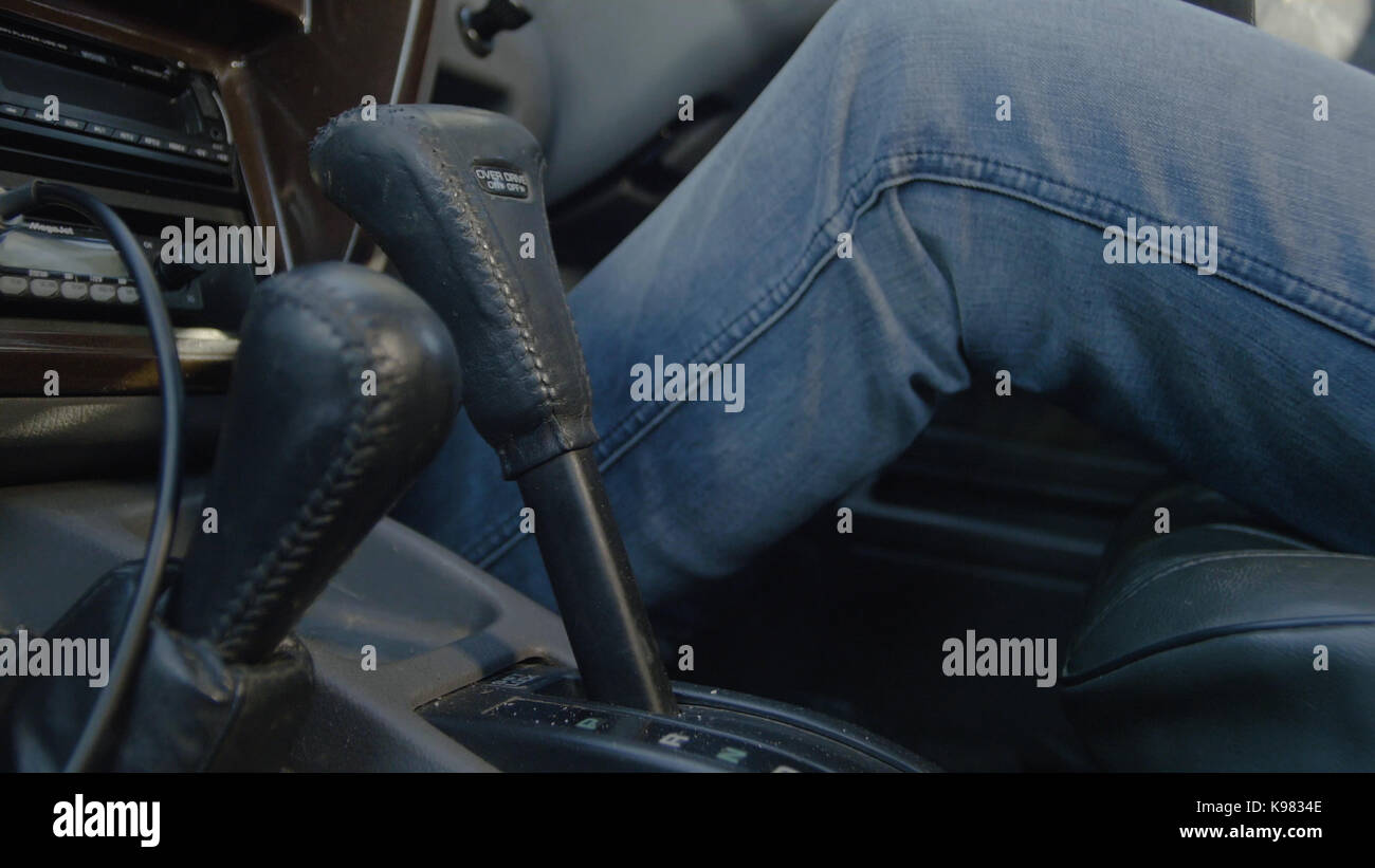 Hand shifting the gear stick. Shifts the transmission Stock Photo - Alamy