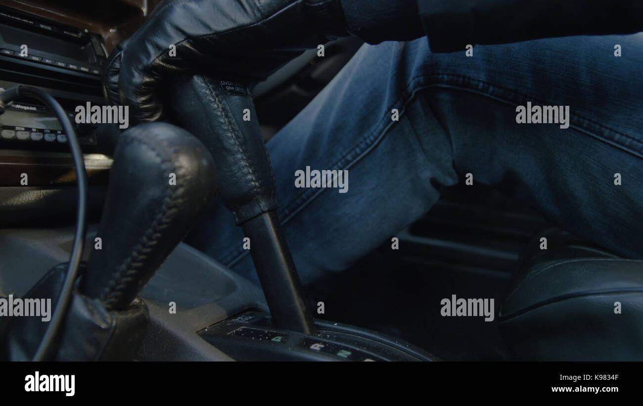 Hand shifting the gear stick. Shifts the transmission Stock Photo - Alamy