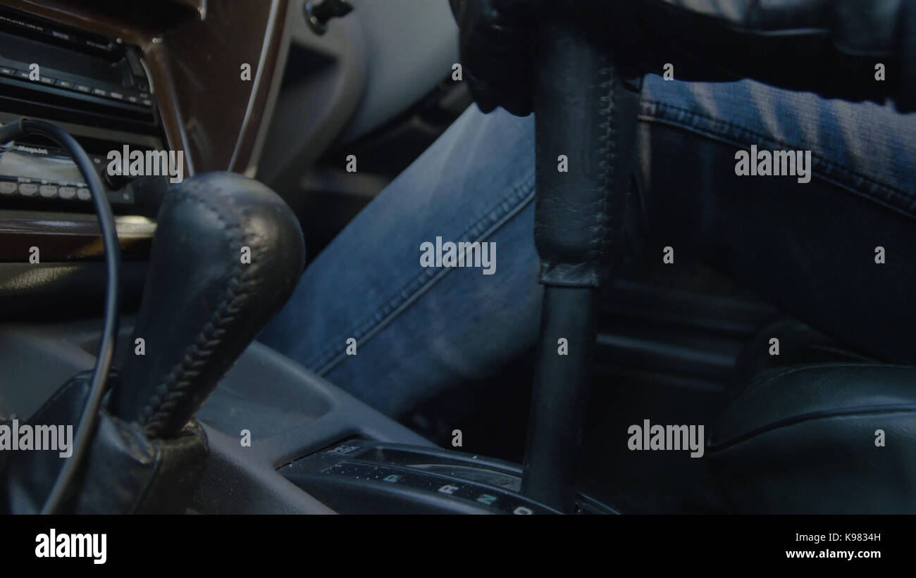 Hand shifting the gear stick. Shifts the transmission Stock Photo - Alamy