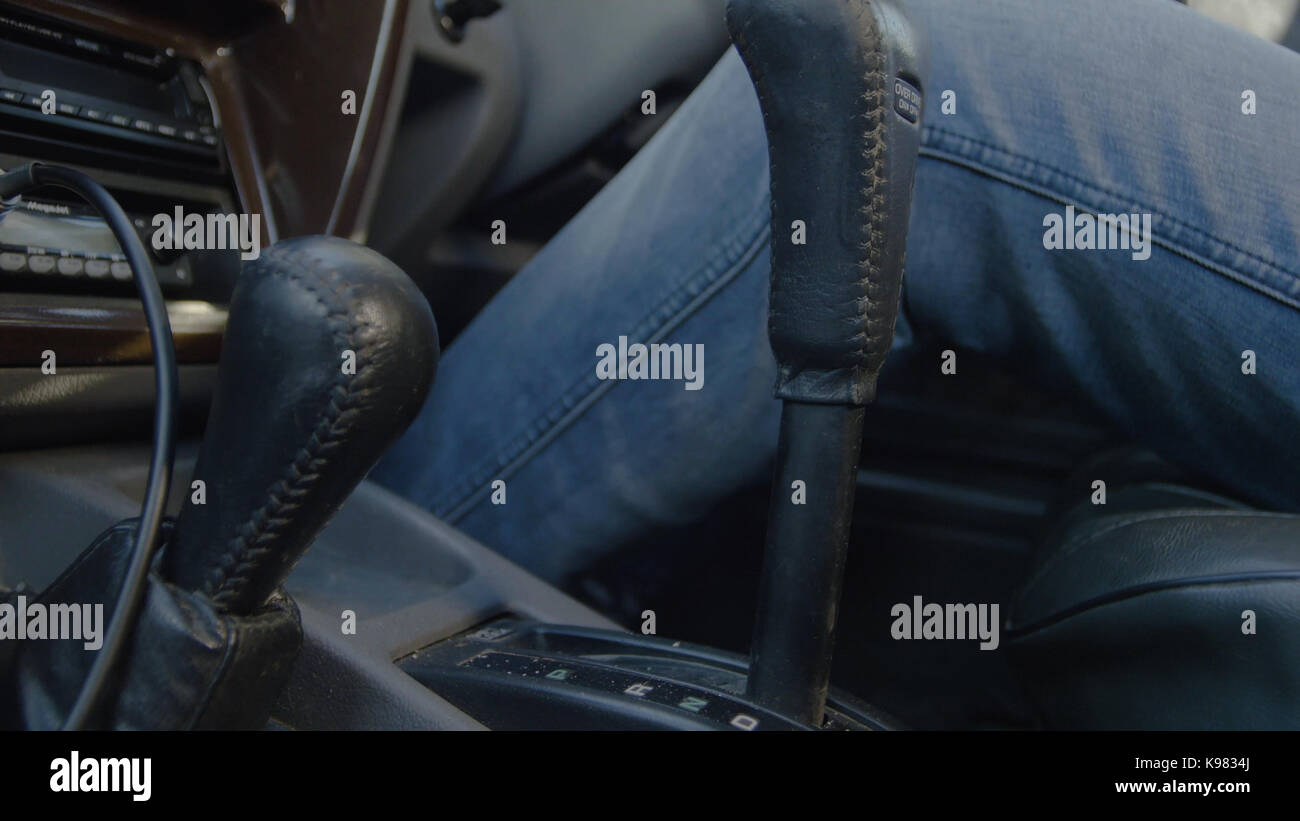 Hand shifting the gear stick. Shifts the transmission Stock Photo - Alamy