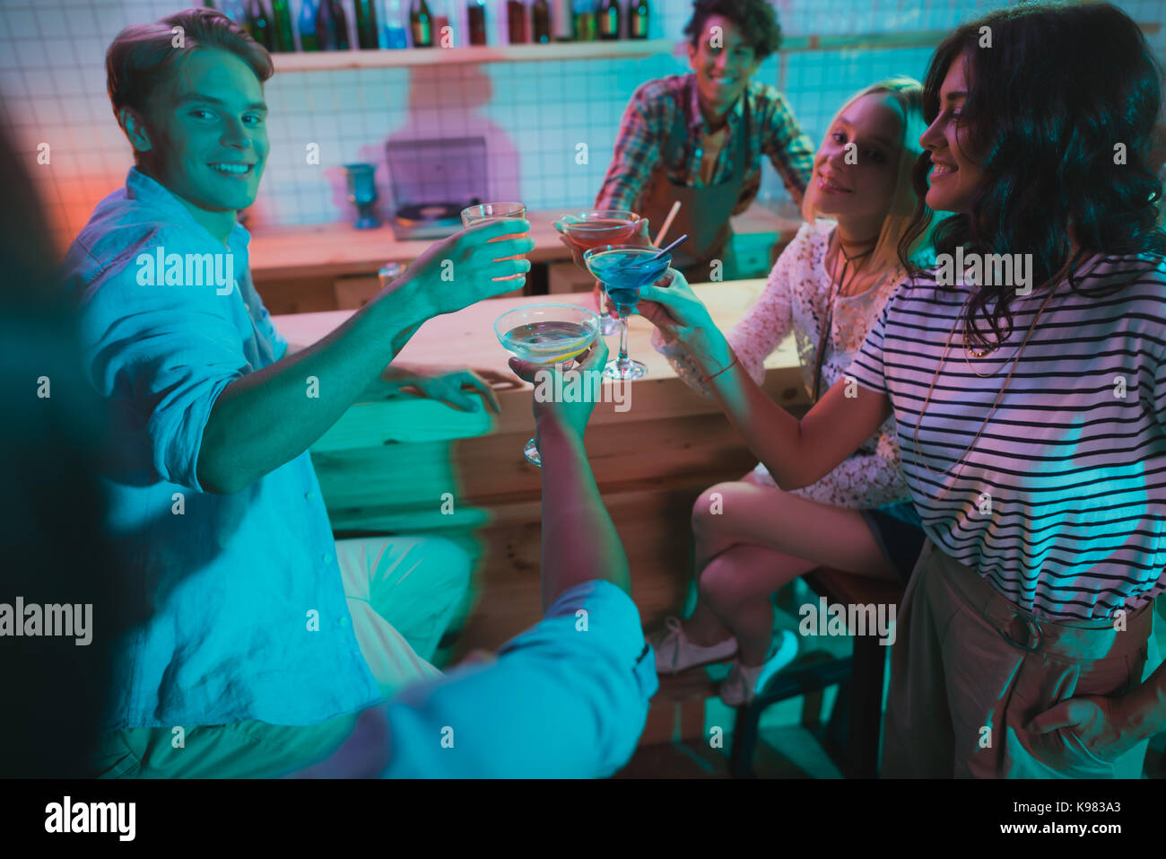 friends with drinks in bar Stock Photo - Alamy