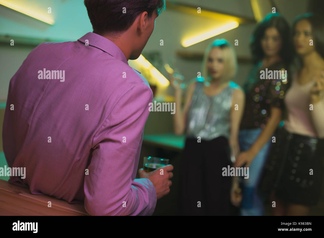 man leaning on wooden counter Stock Photo - Alamy