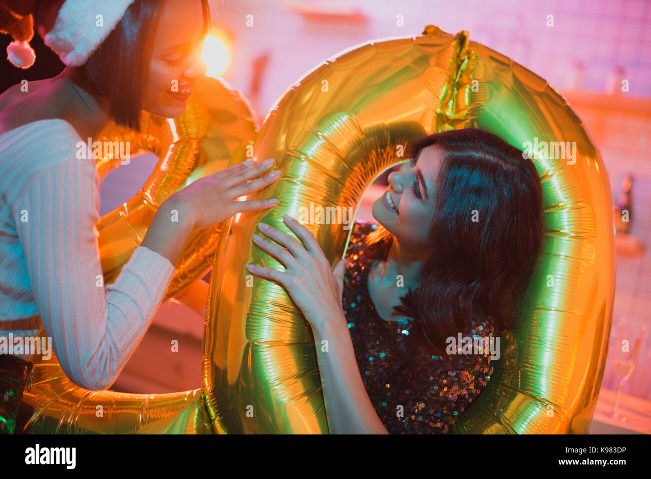 multicultural women with balloons Stock Photo - Alamy