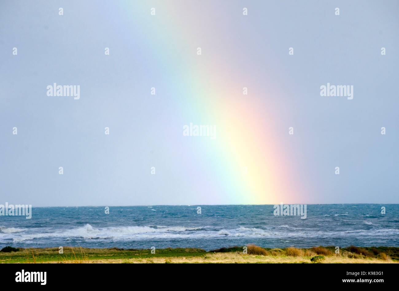 Rainbow over sea, Flat Point, Wairarapa, North Island, New Zealand ...
