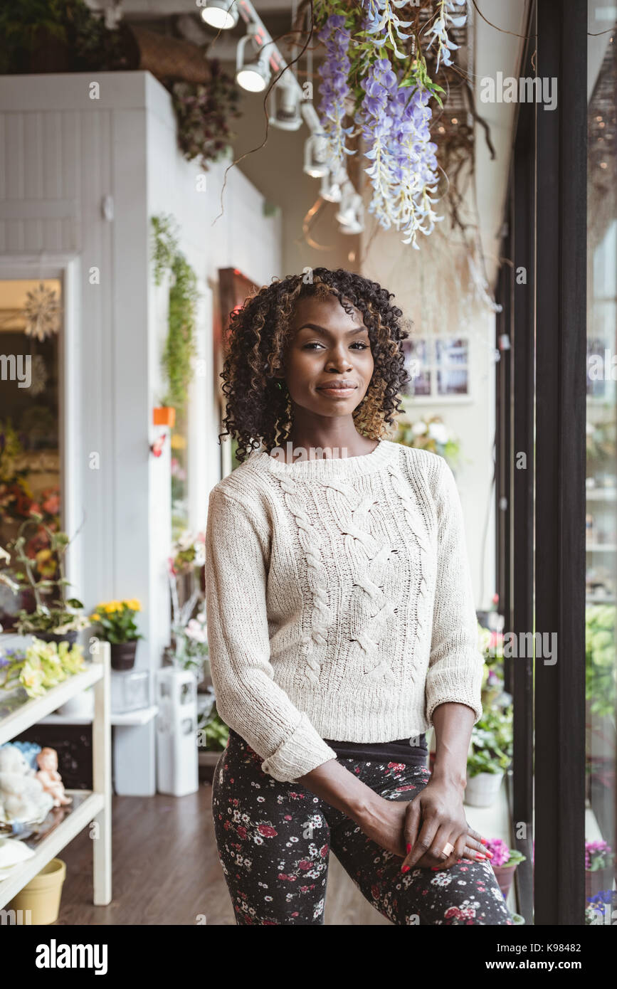 Portrait of female florist standing at flower shop Stock Photo - Alamy