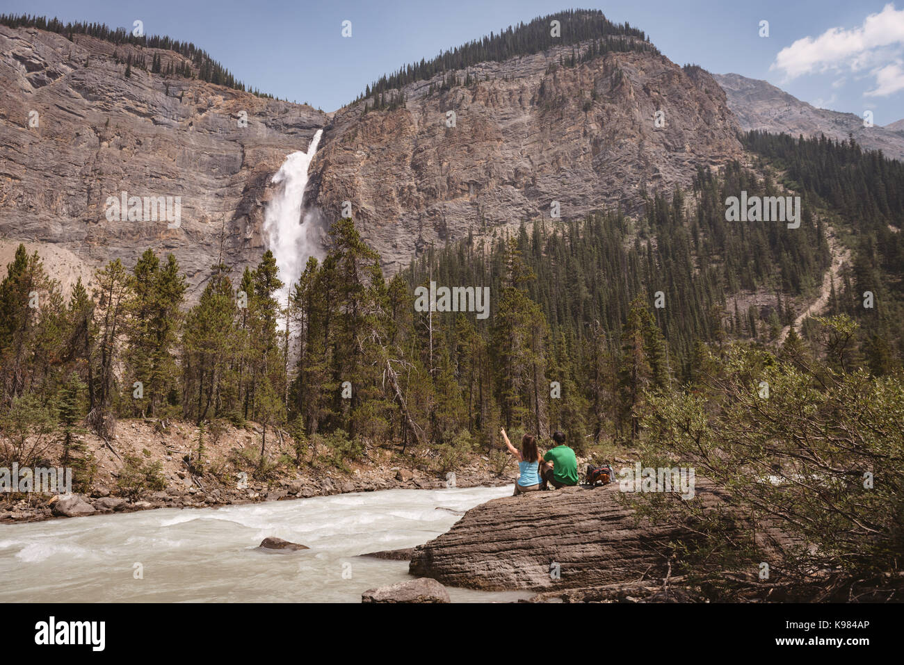Sitting man looking waterfall hi-res stock photography and images - Alamy