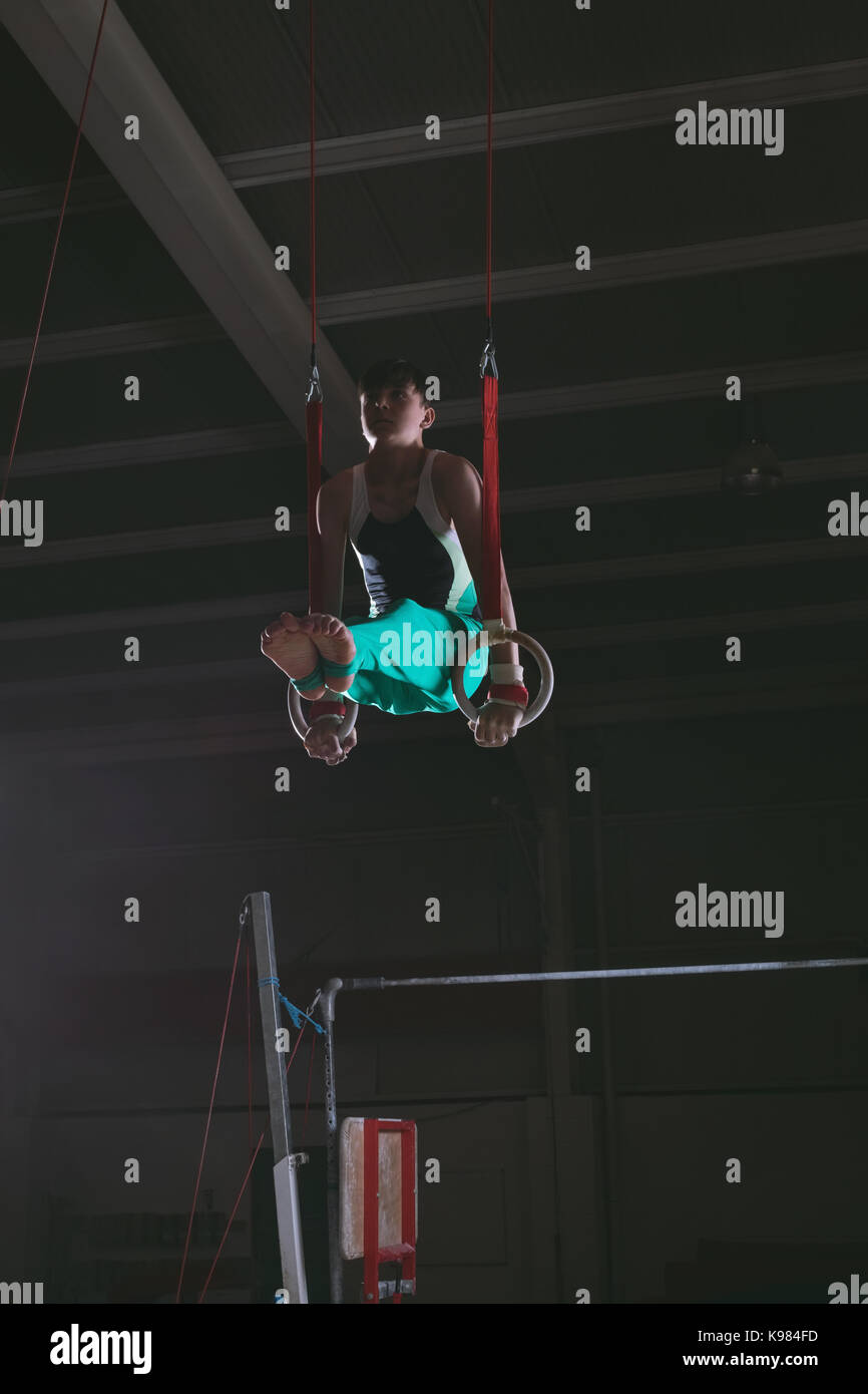 Male gymnast on rings hi-res stock photography and images - Alamy