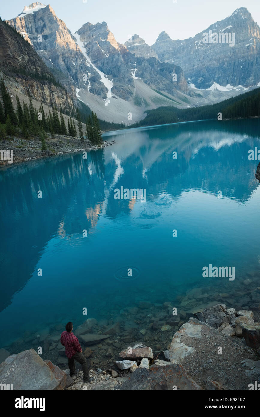 Man standing by lake hi-res stock photography and images - Alamy
