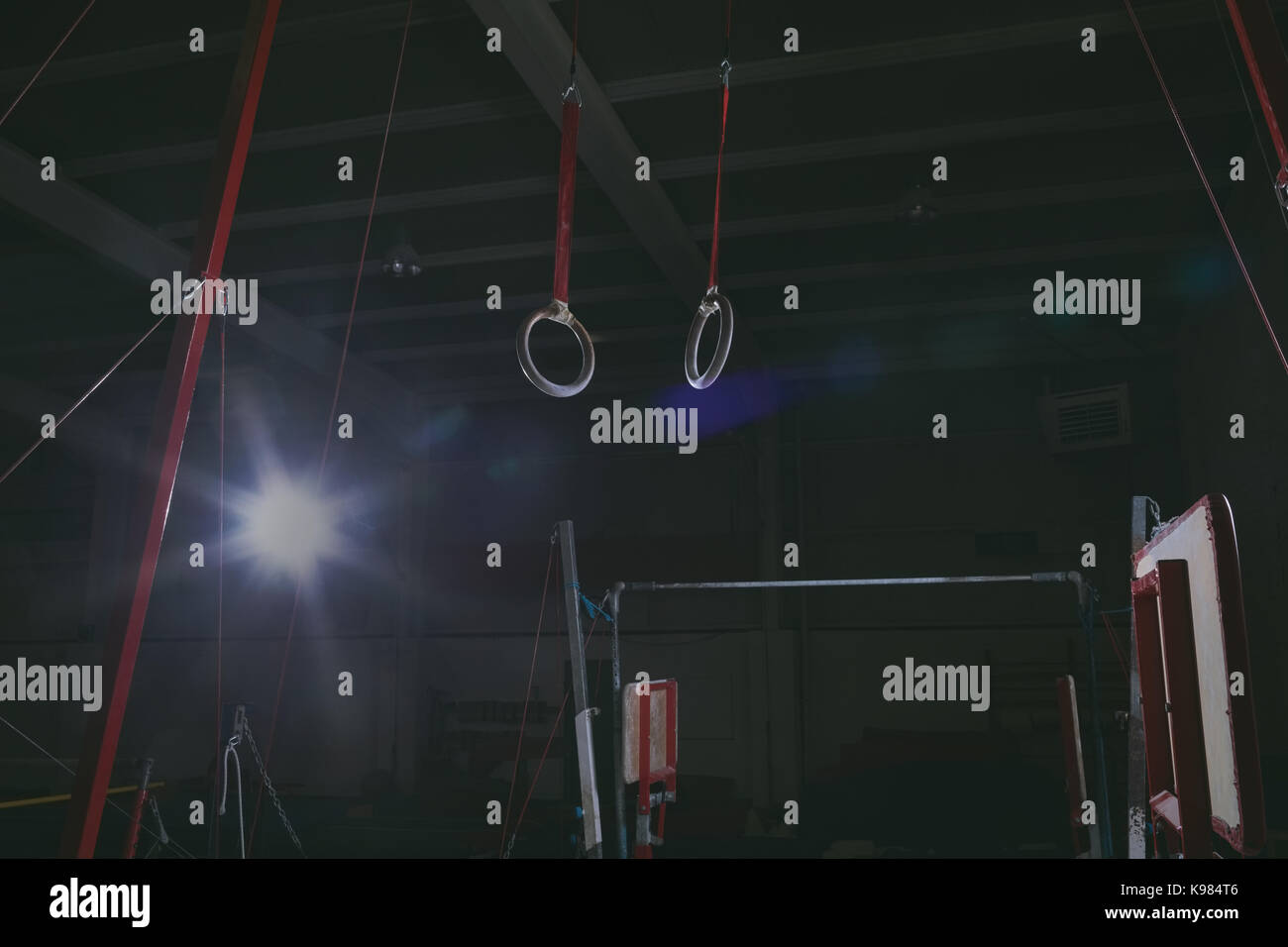 Empty gymnastic rings and horizontal bar in the gym Stock Photo - Alamy