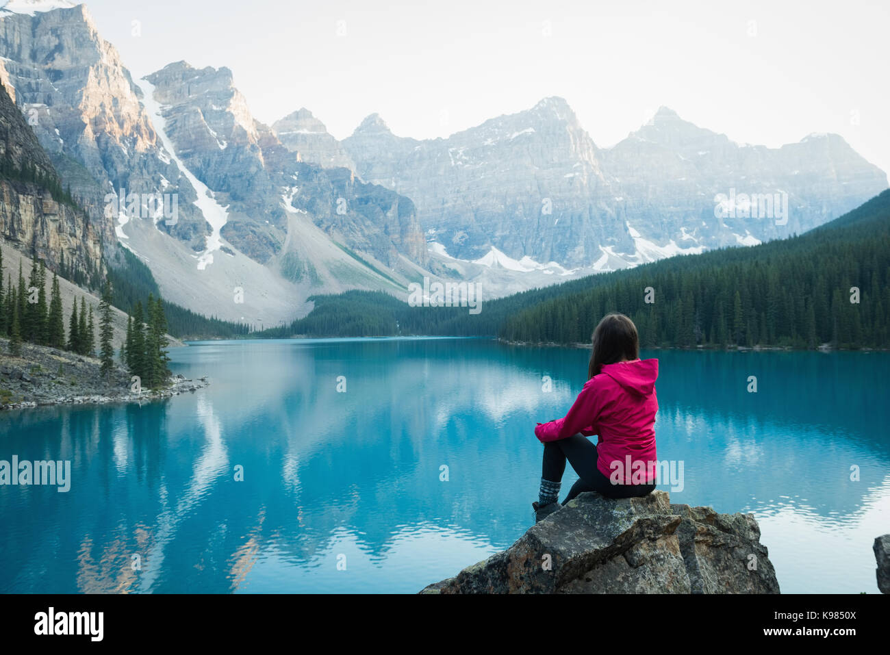 Woman sitting near a lake hi-res stock photography and images - Alamy