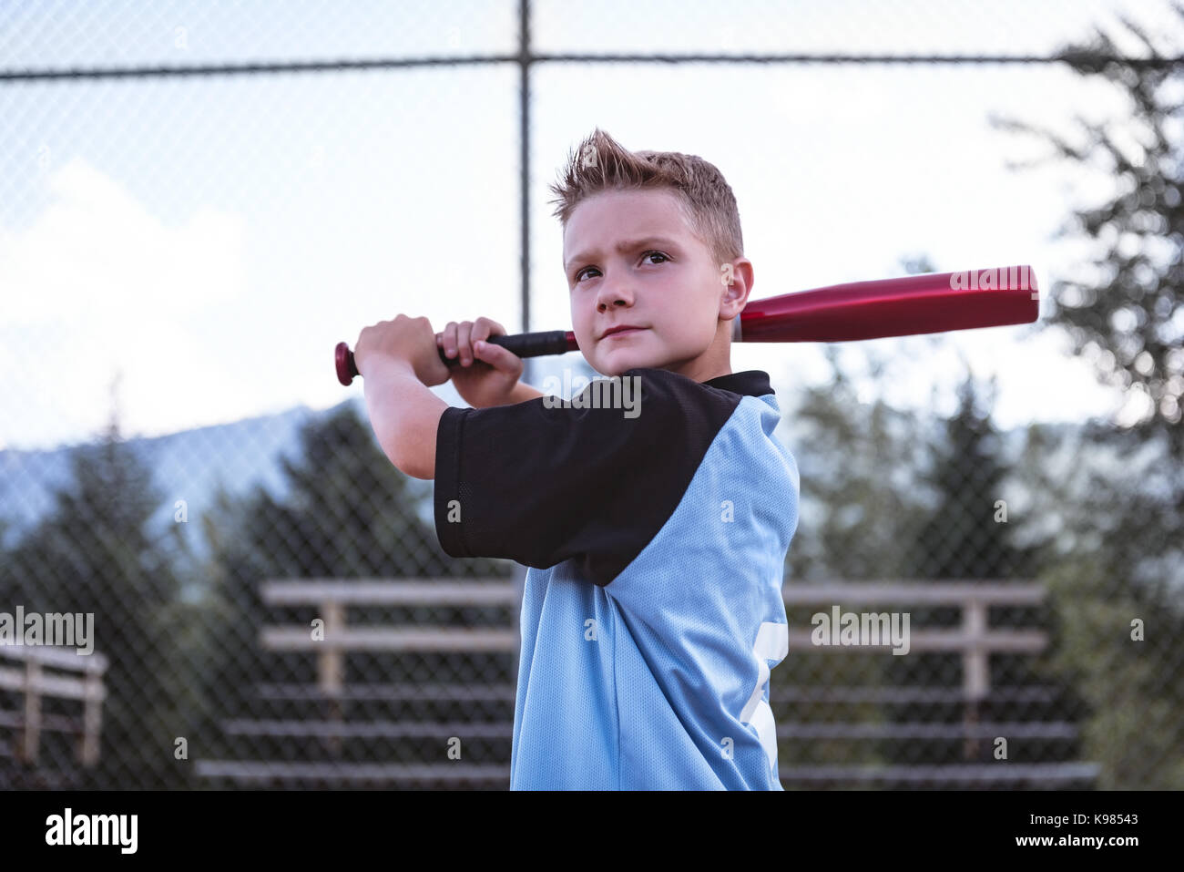 Determined boy practicing baseball Stock Photo - Alamy