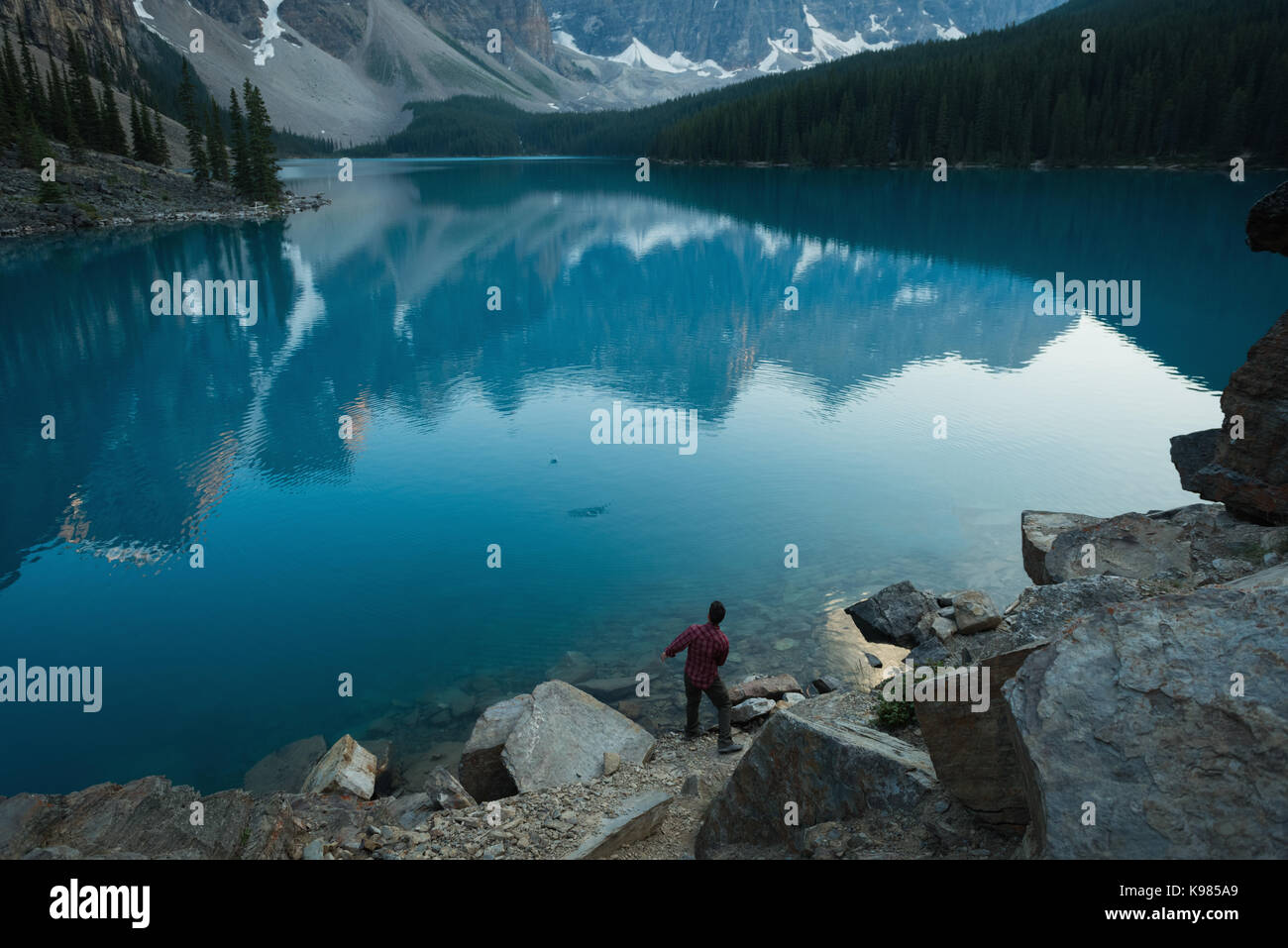 Man standing by lake hi-res stock photography and images - Alamy
