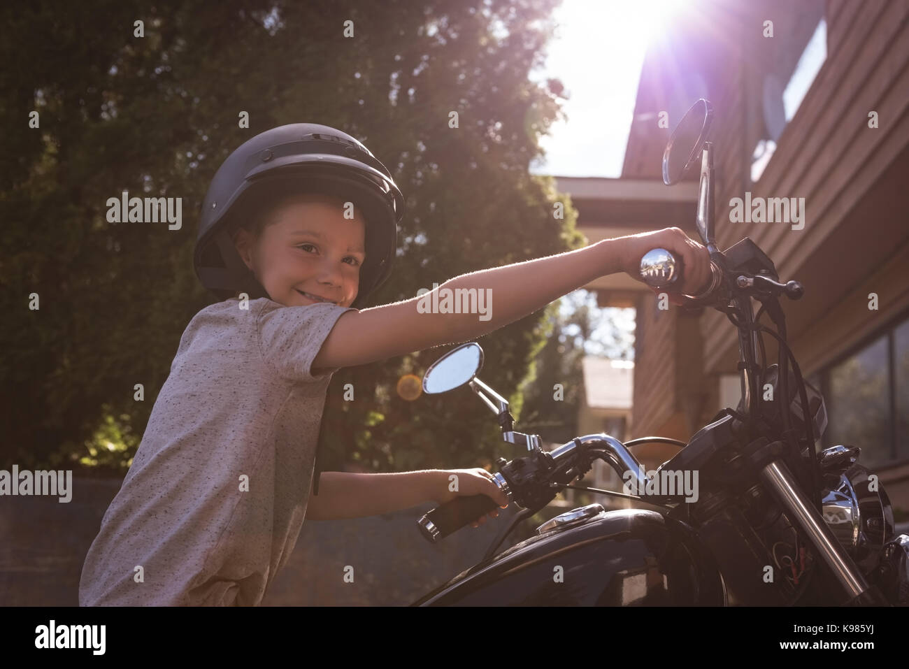 Boy riding on motorcycle hi-res stock photography and images - Alamy