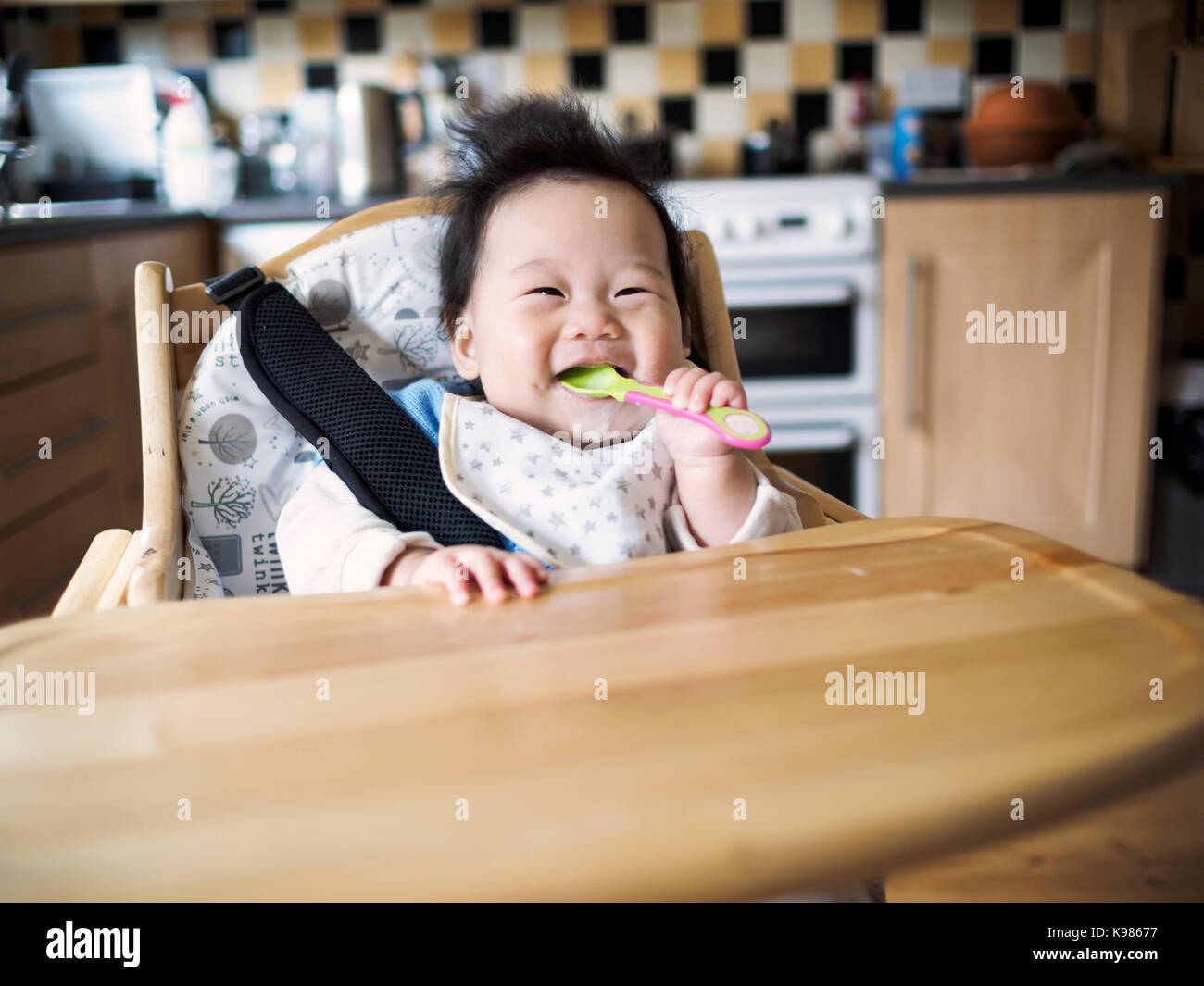 baby girl weaning first time Stock Photo - Alamy