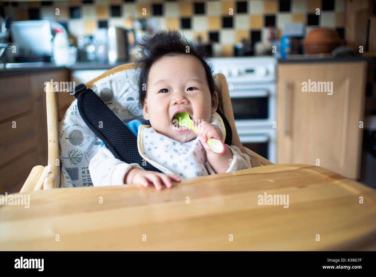 baby girl weaning first time Stock Photo - Alamy