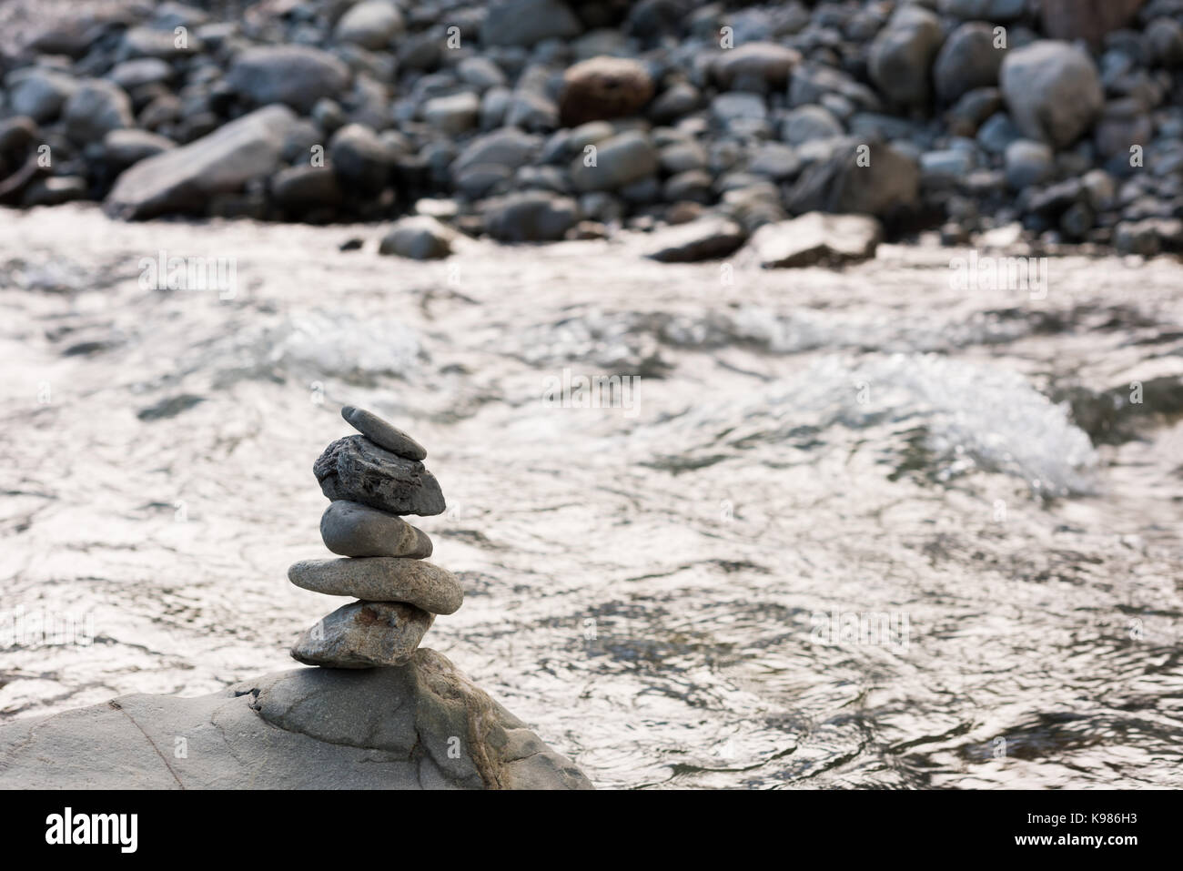 Close-up of balanced stones in a riverbed Stock Photo - Alamy
