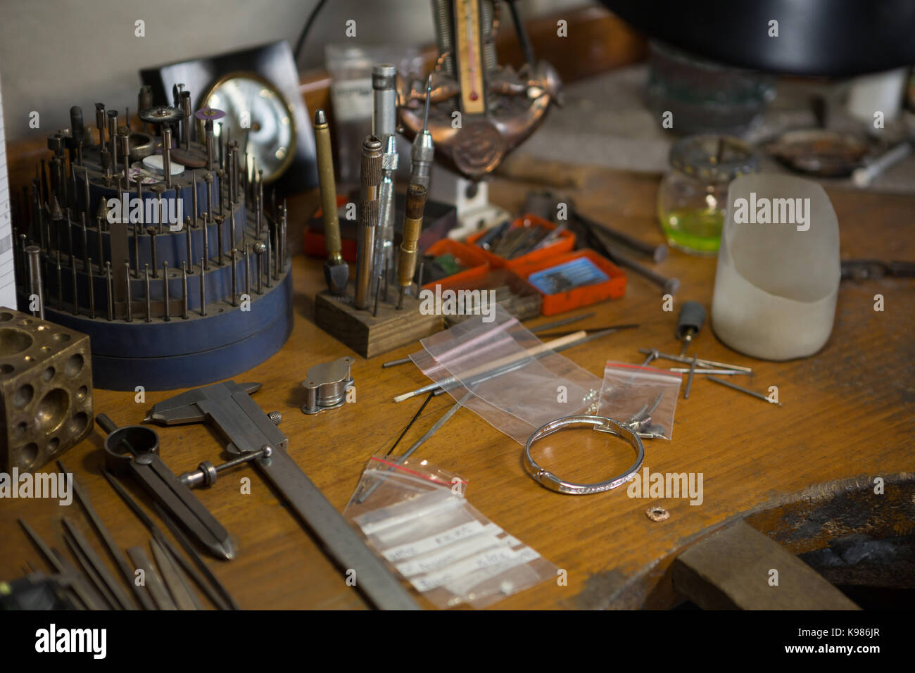 Close-up of various tools arranged on wooden table Stock Photo - Alamy