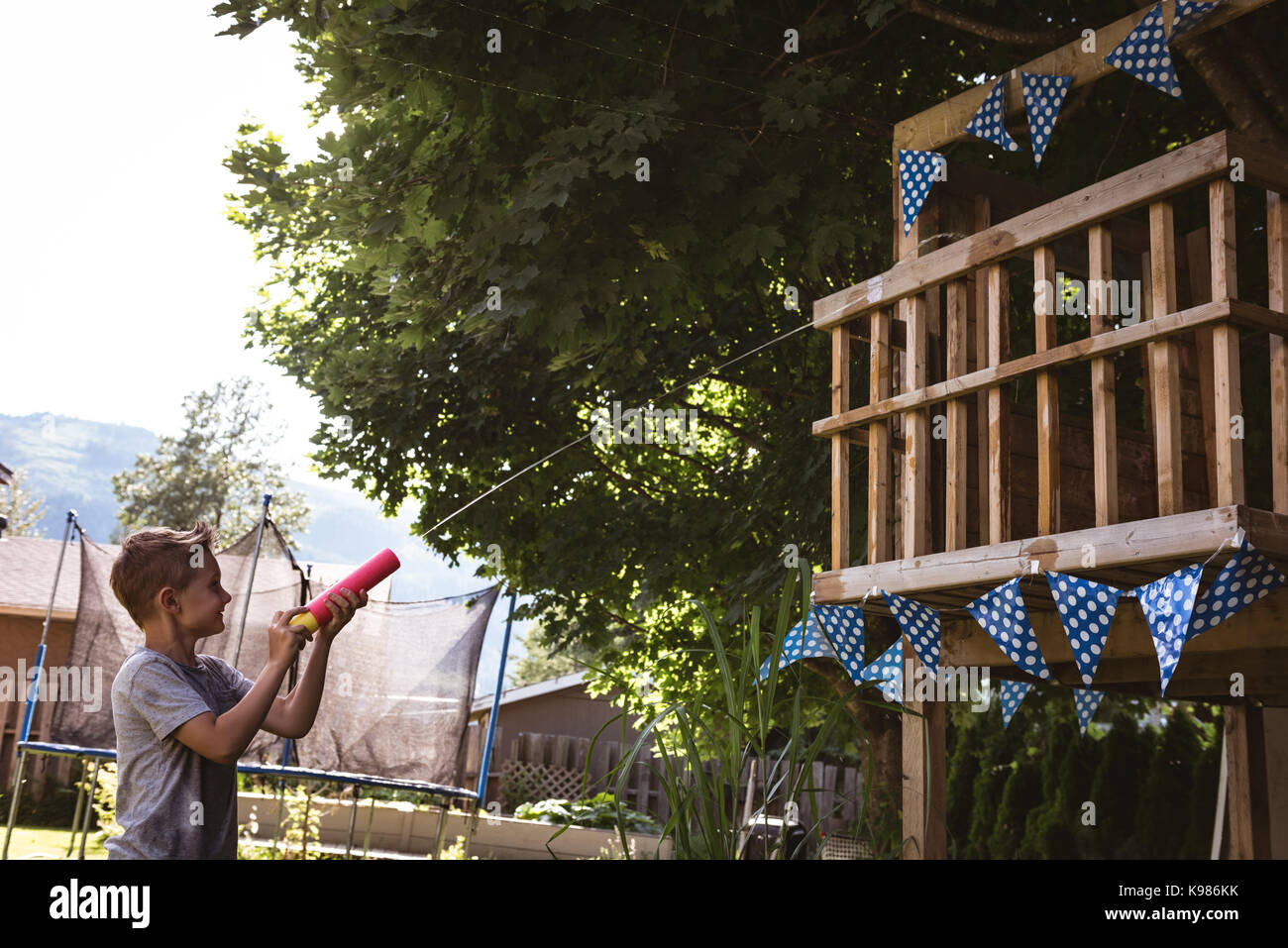 Boy playing with gun hi-res stock photography and images - Alamy
