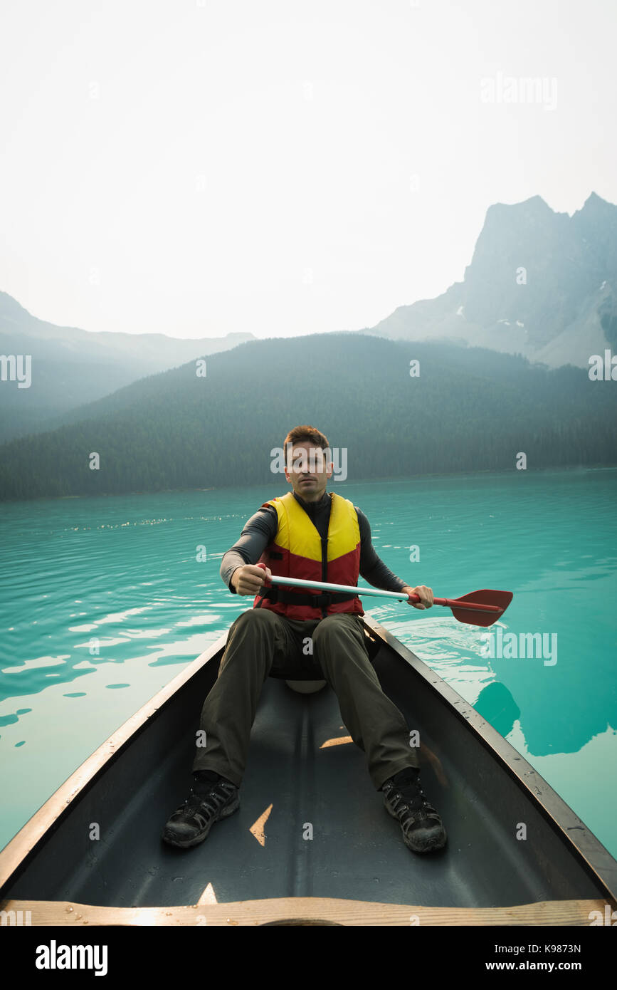 Portrait of man kayaking in lake Stock Photo - Alamy