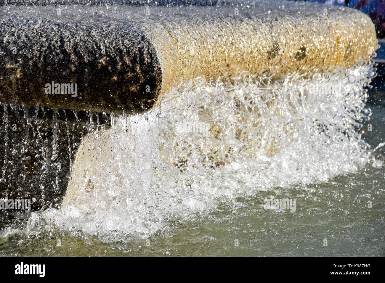Water cascading over a stone ledge Stock Photo - Alamy