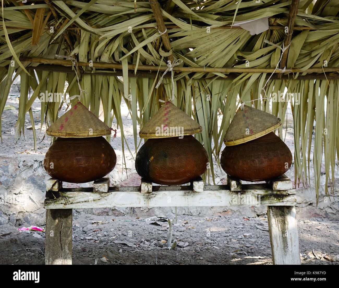 Clay pots with water for drinking at the Buddhist pagoda in Mandalay ...
