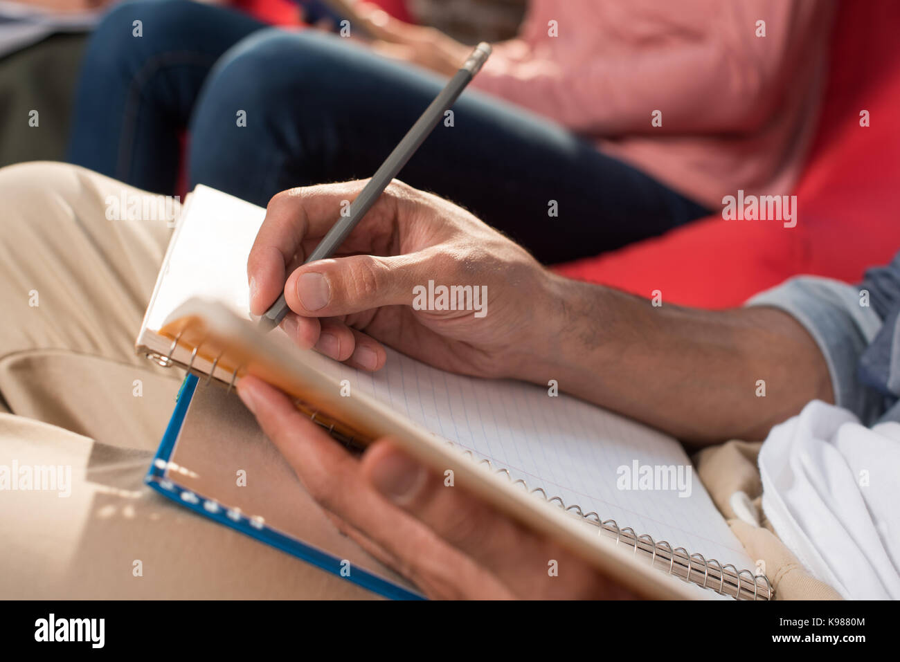 People writing together hi-res stock photography and images - Alamy