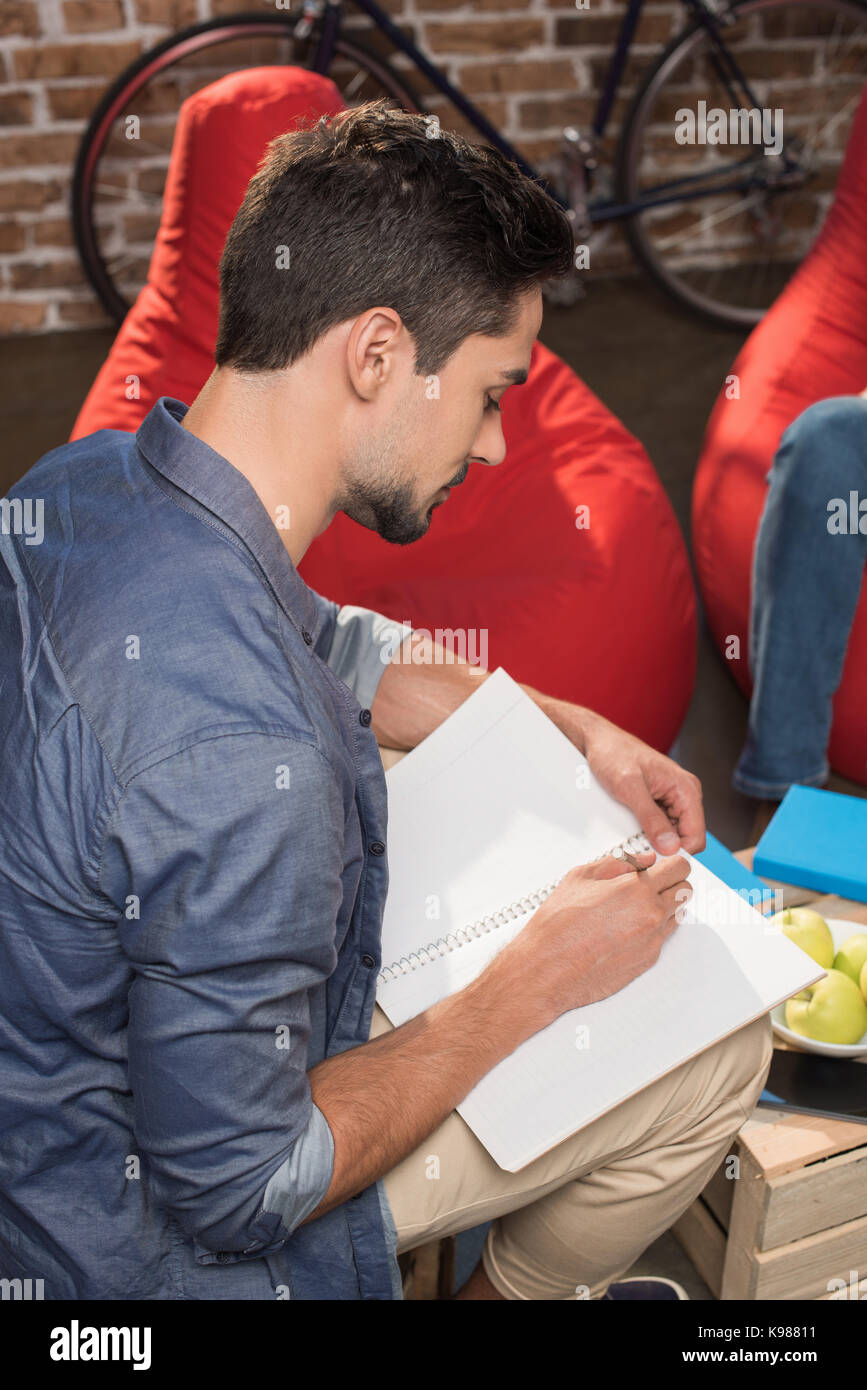 student writing in copybook Stock Photo - Alamy