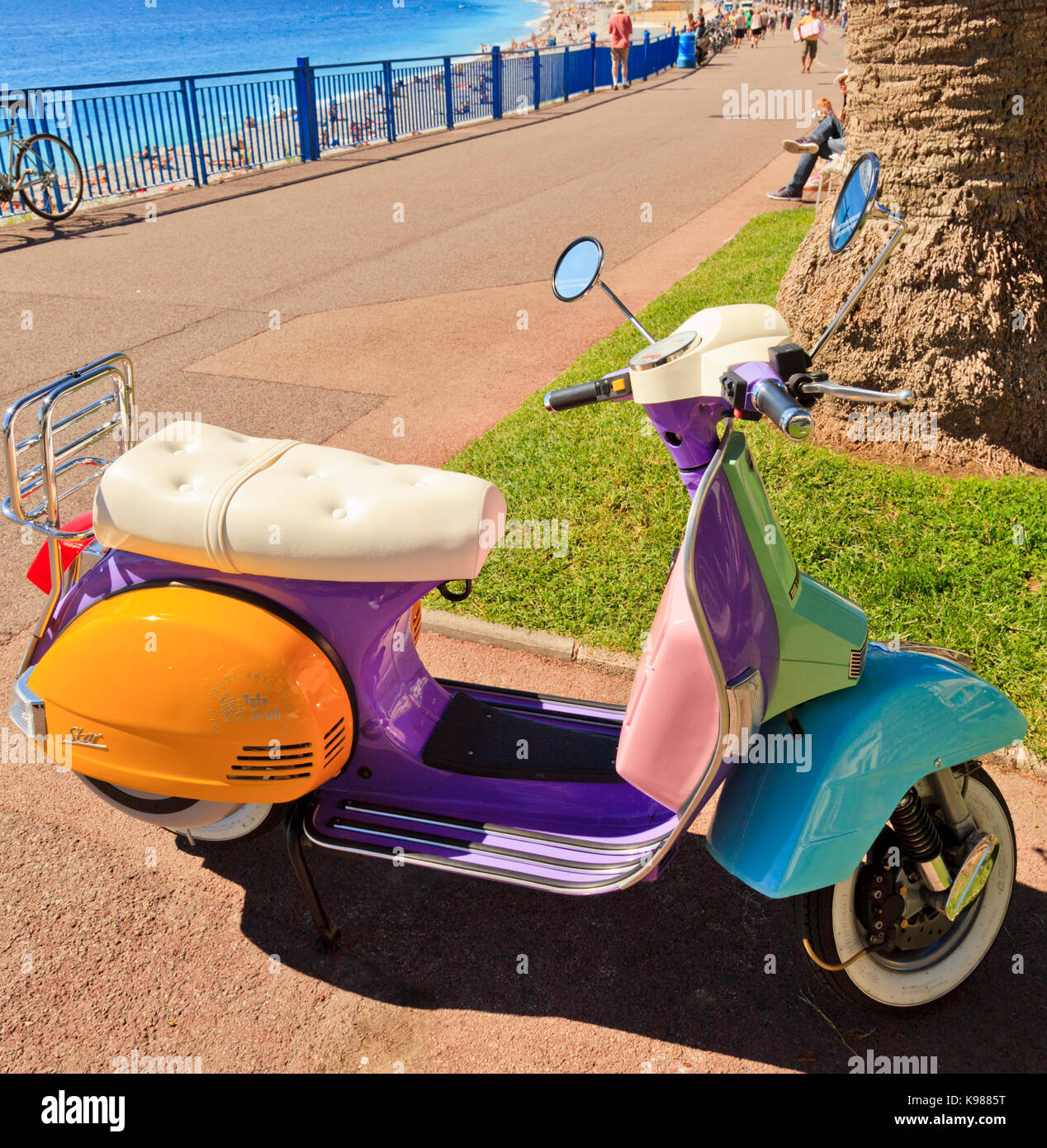 A brightly painted scooter on the promenade in Nice France Stock Photo ...