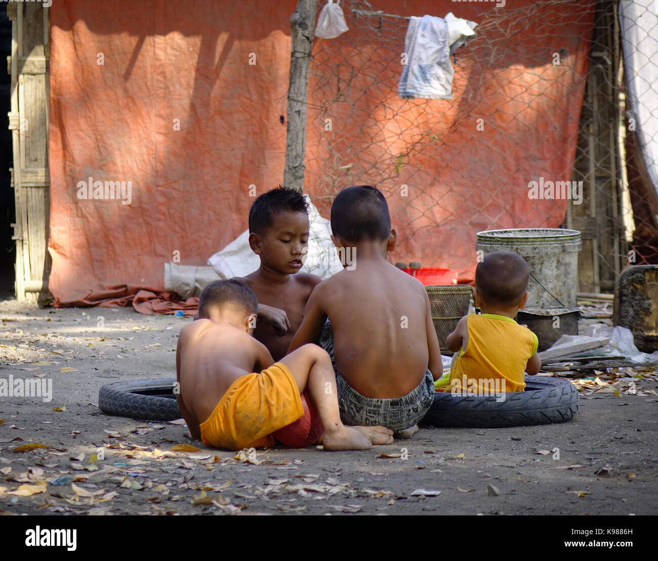 Mandalay, Myanmar - Feb 11, 2017. Children playing at poor village in ...