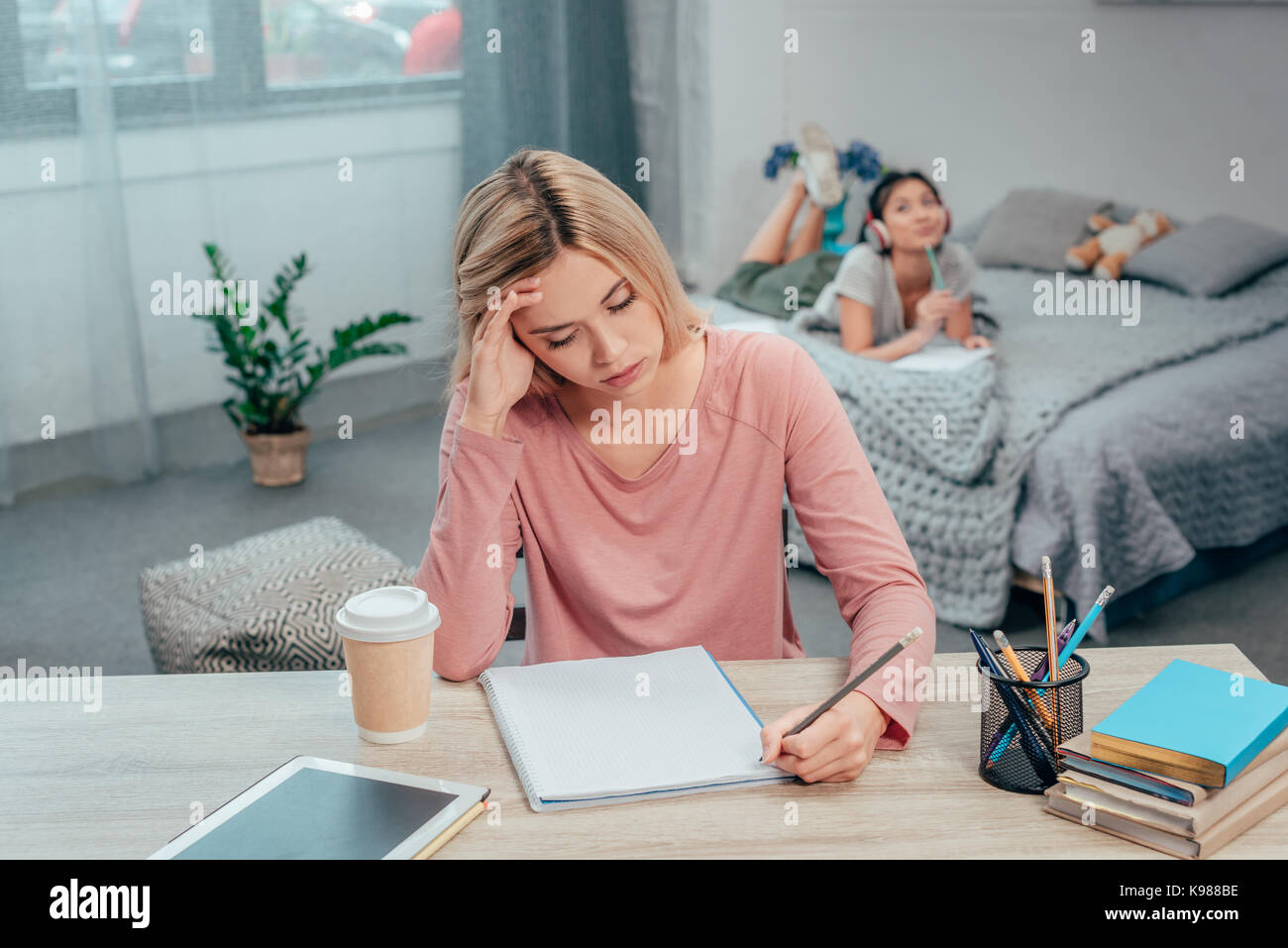 young bored woman studying Stock Photo - Alamy