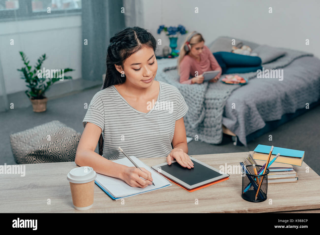 asian woman studying at home Stock Photo - Alamy