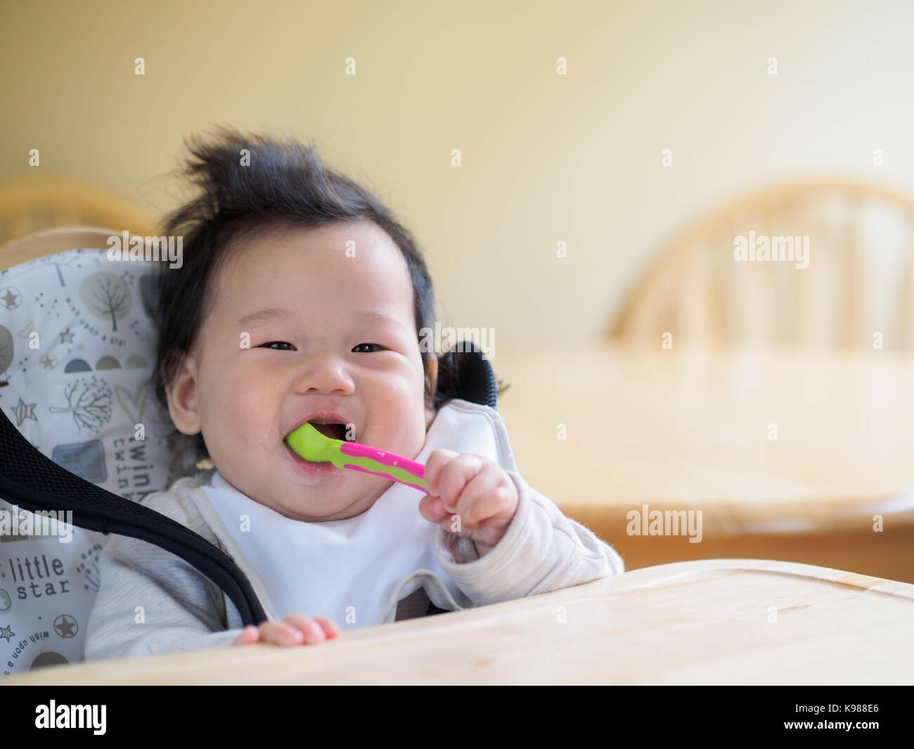 baby girl weaning first time Stock Photo - Alamy