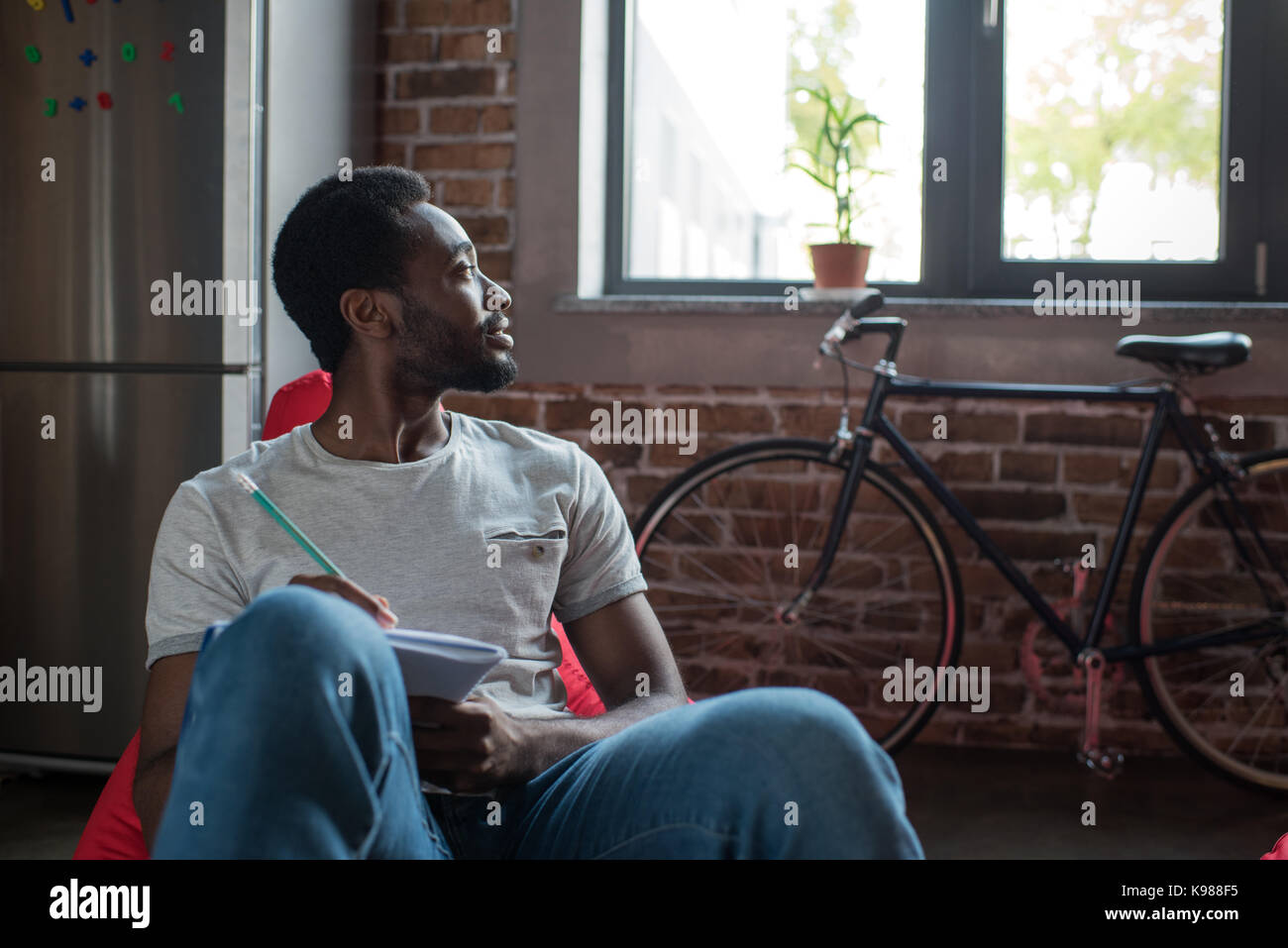 Young male afro student hi-res stock photography and images - Alamy