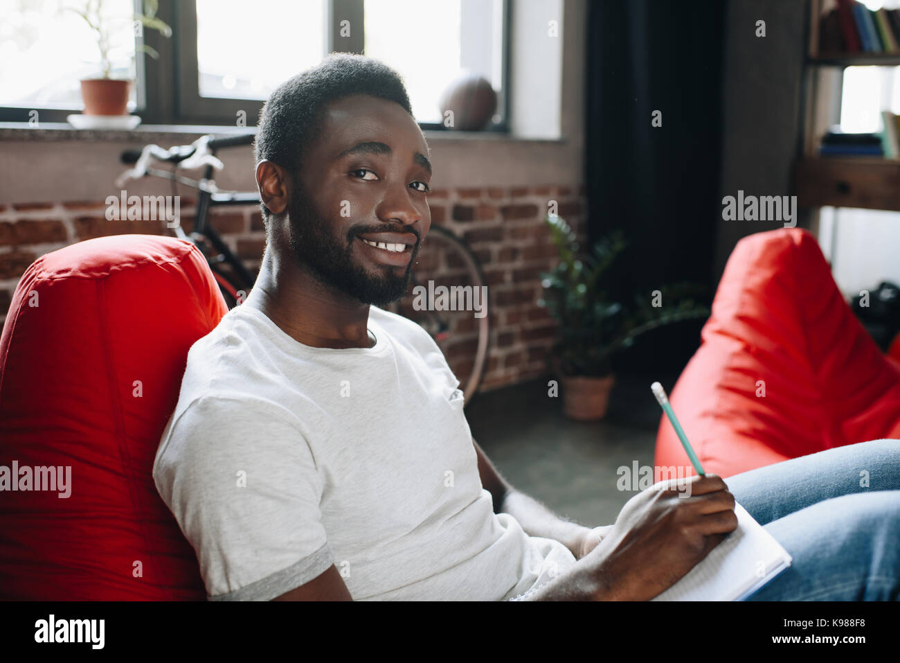 Young people writing hi-res stock photography and images - Alamy