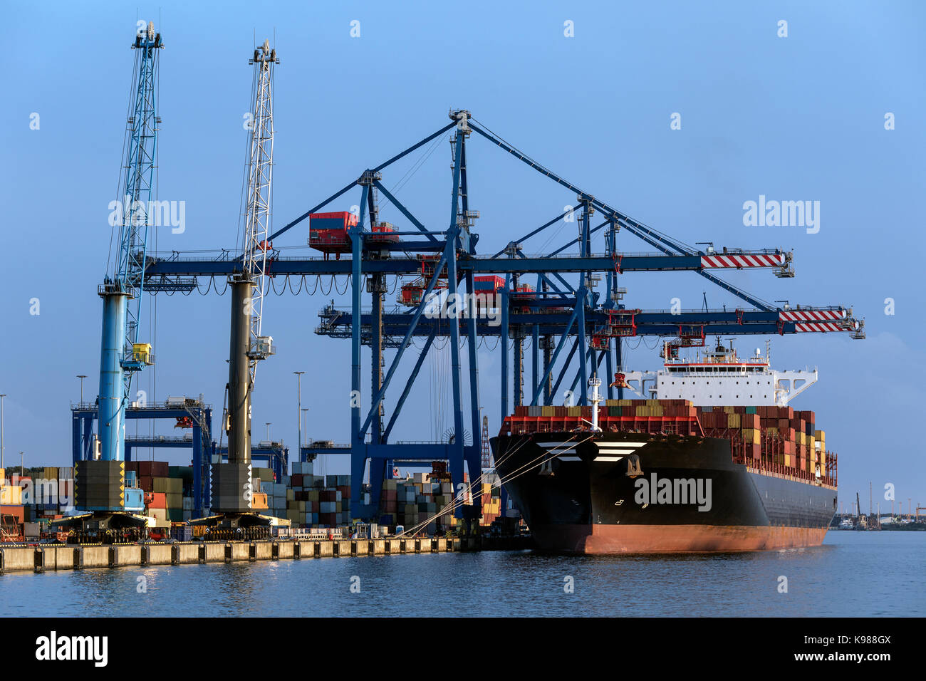 A large container ship unloading in the port of Klaipeda in Lithuania ...