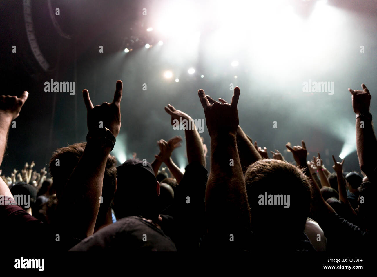 a crowd shadow of people at during a concert Stock Photo - Alamy
