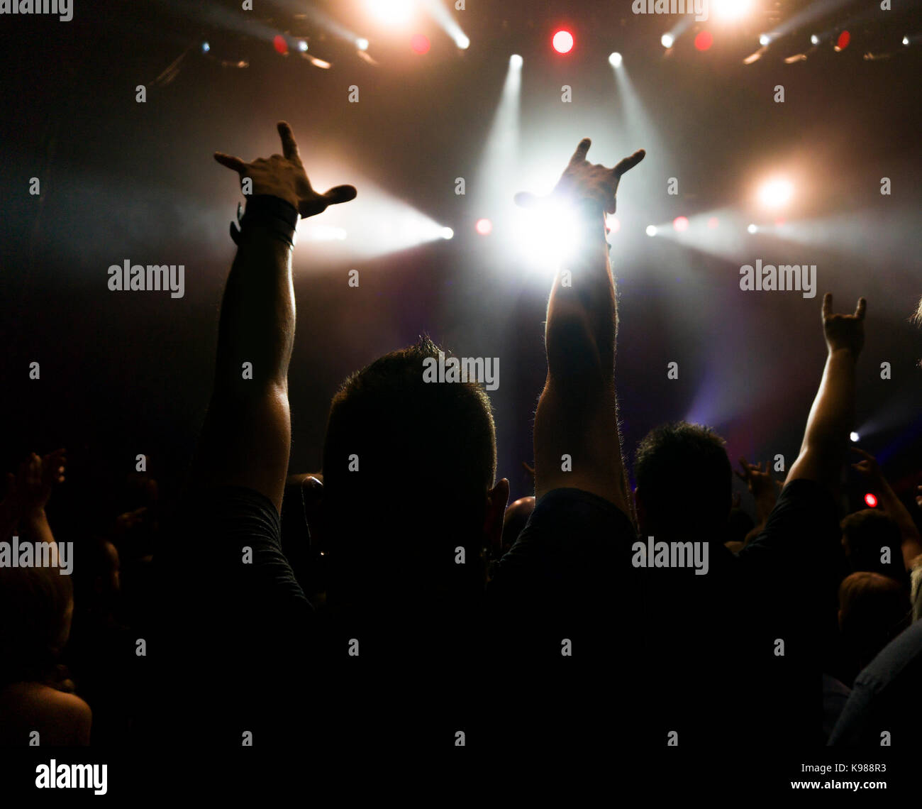 a crowd shadow of people at during a concert Stock Photo - Alamy