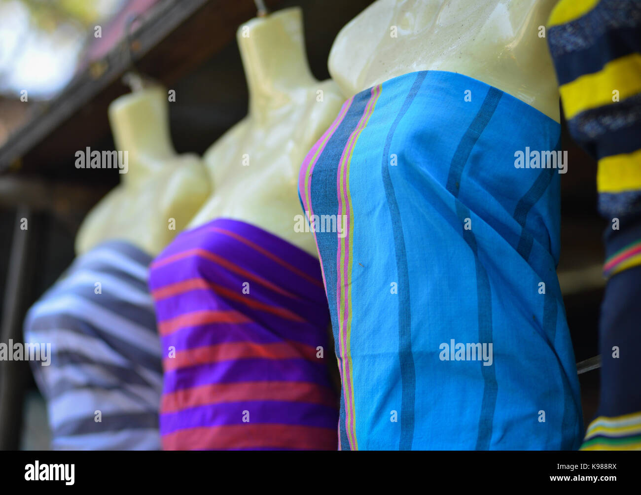 Colorful textile for sale at a traditional market in Yangon, Myanmar ...