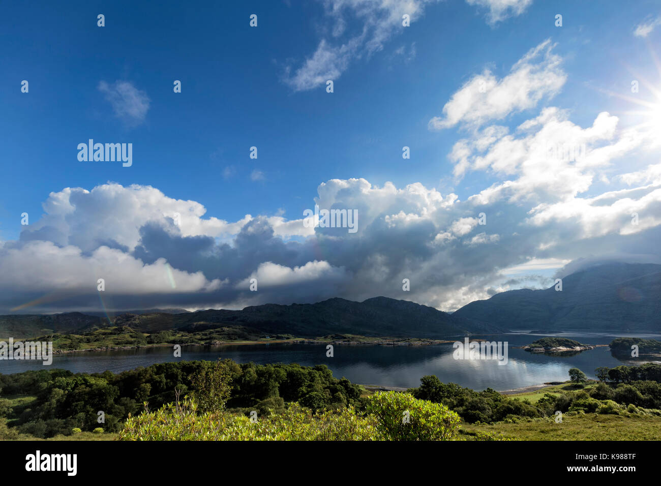 The sun peaks out above morning clouds over Loch Ailort in Roshven ...