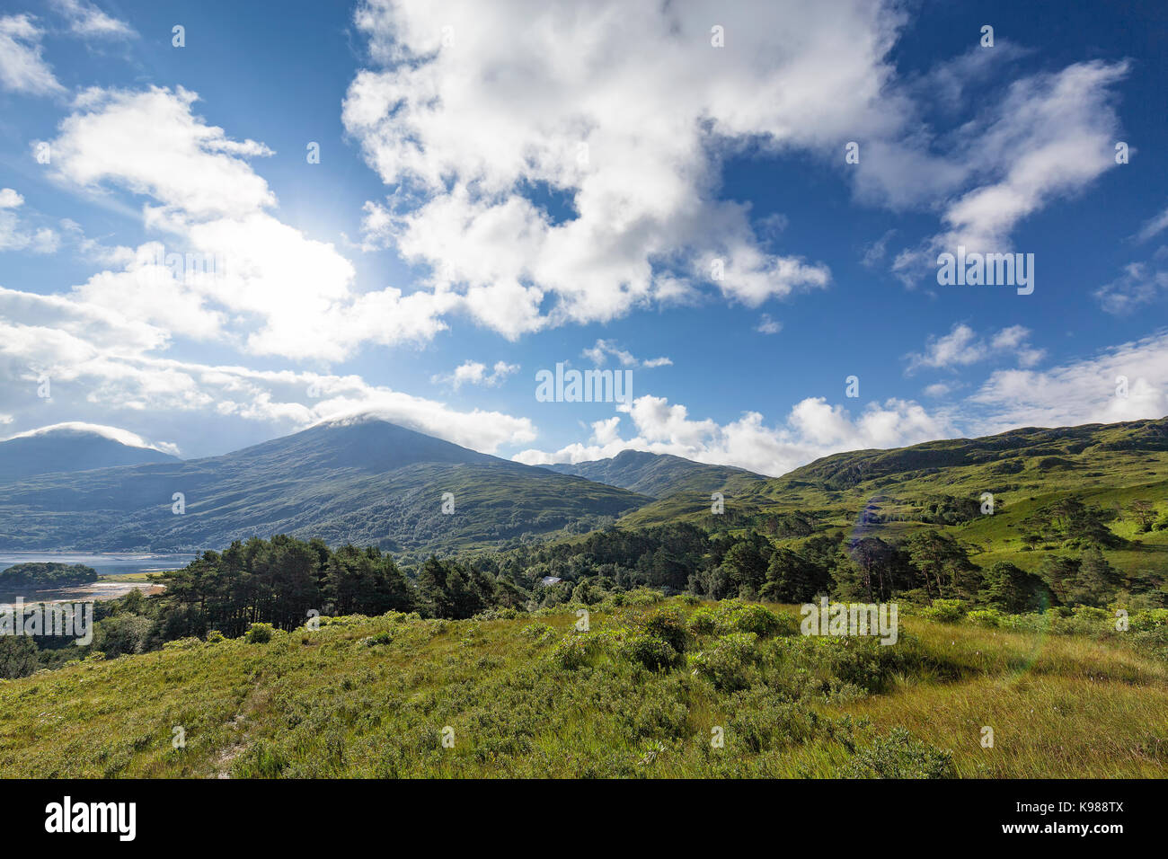 Sun shines over Rois-Bheinn mountain next to Loch Ailort in Roshven ...