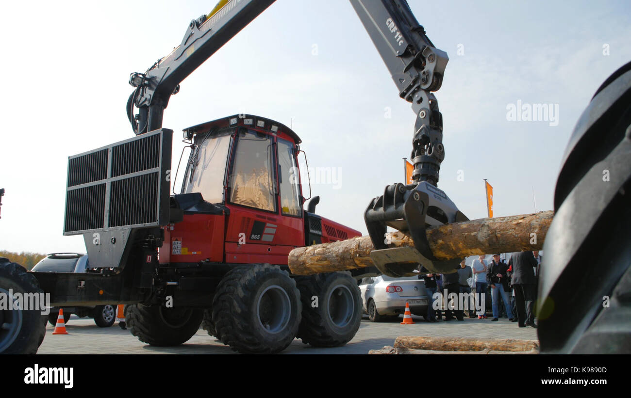 Log loader or forestry machine moves fresh cut logs for loading Stock ...