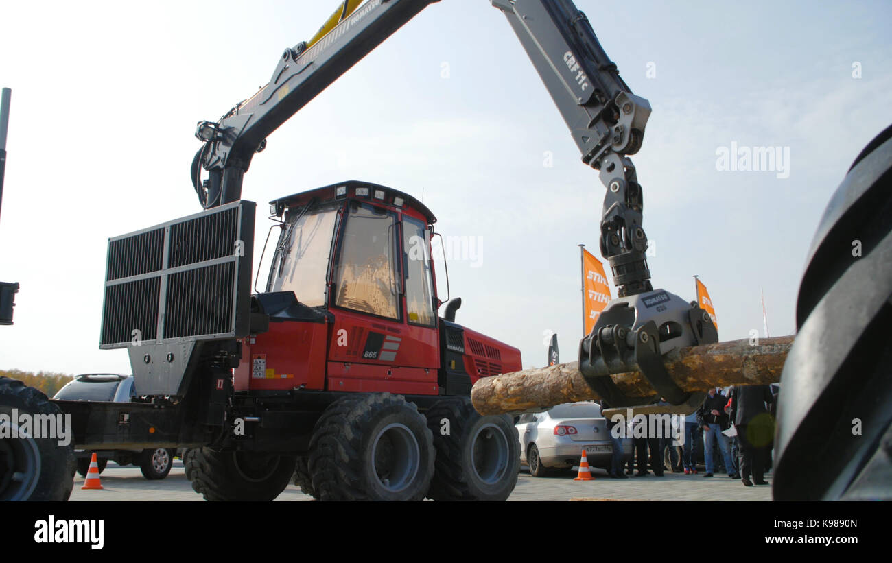 Log loader or forestry machine moves fresh cut logs for loading Stock ...