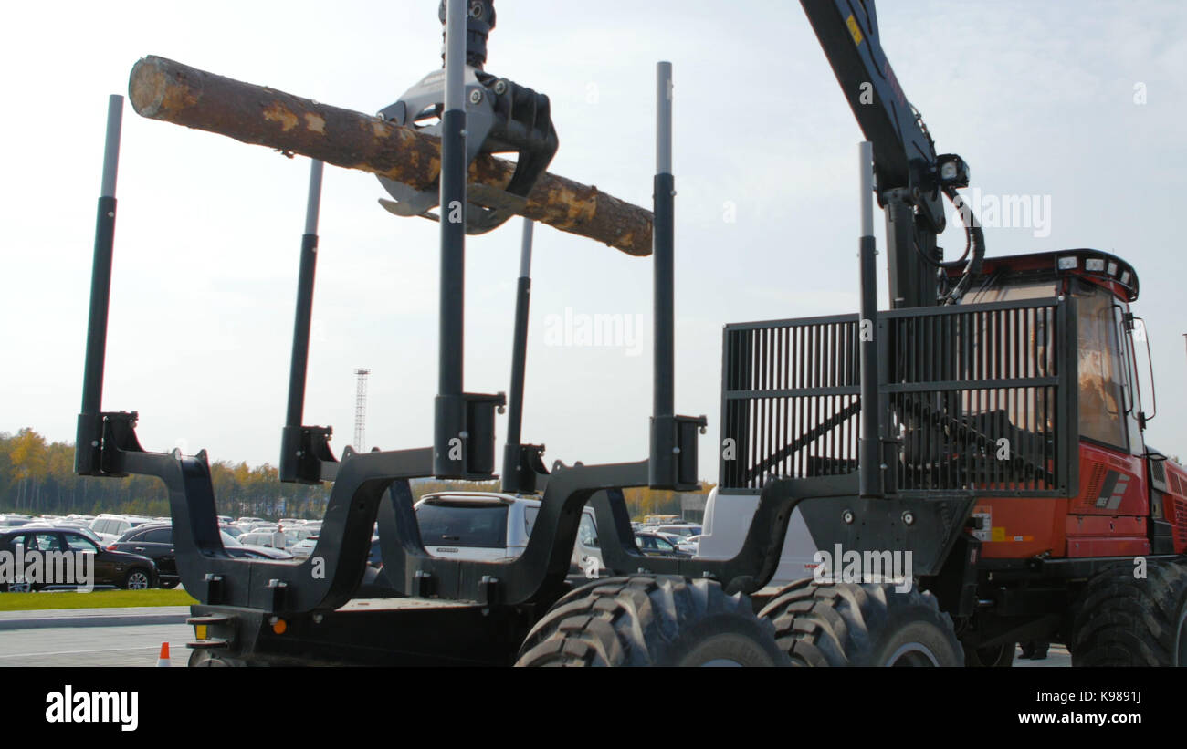 Log loader or forestry machine moves fresh cut logs for loading Stock ...