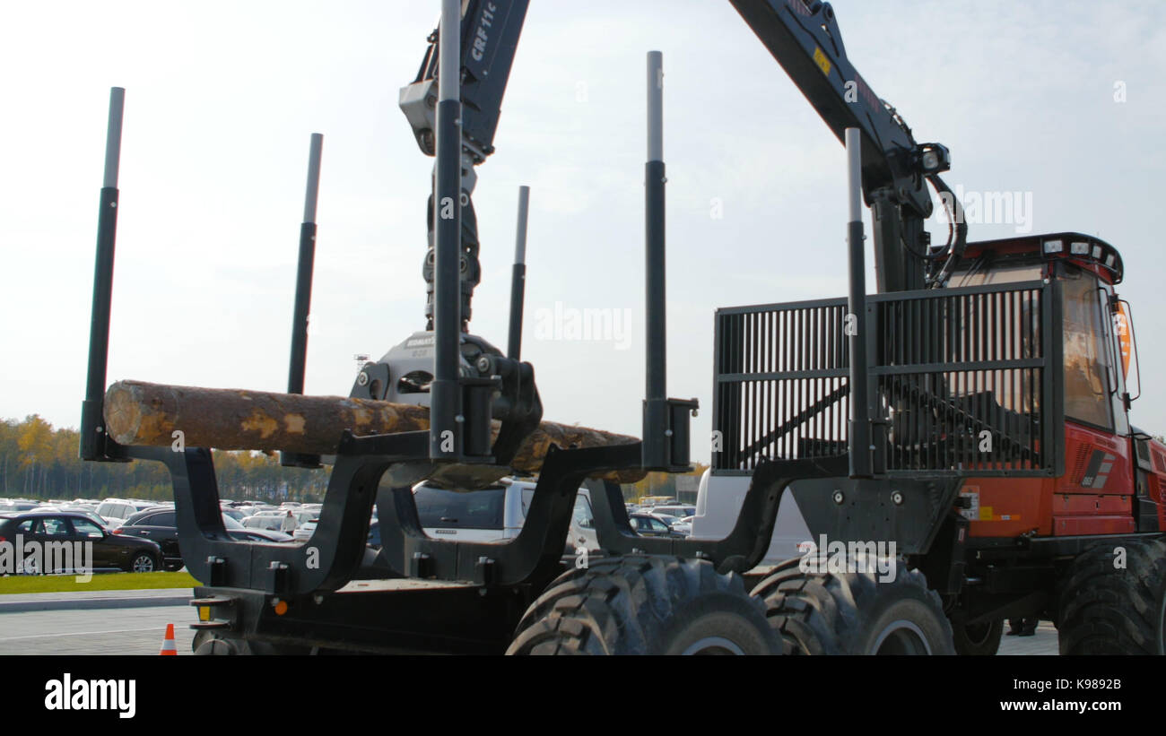 Log loader or forestry machine moves fresh cut logs for loading Stock ...